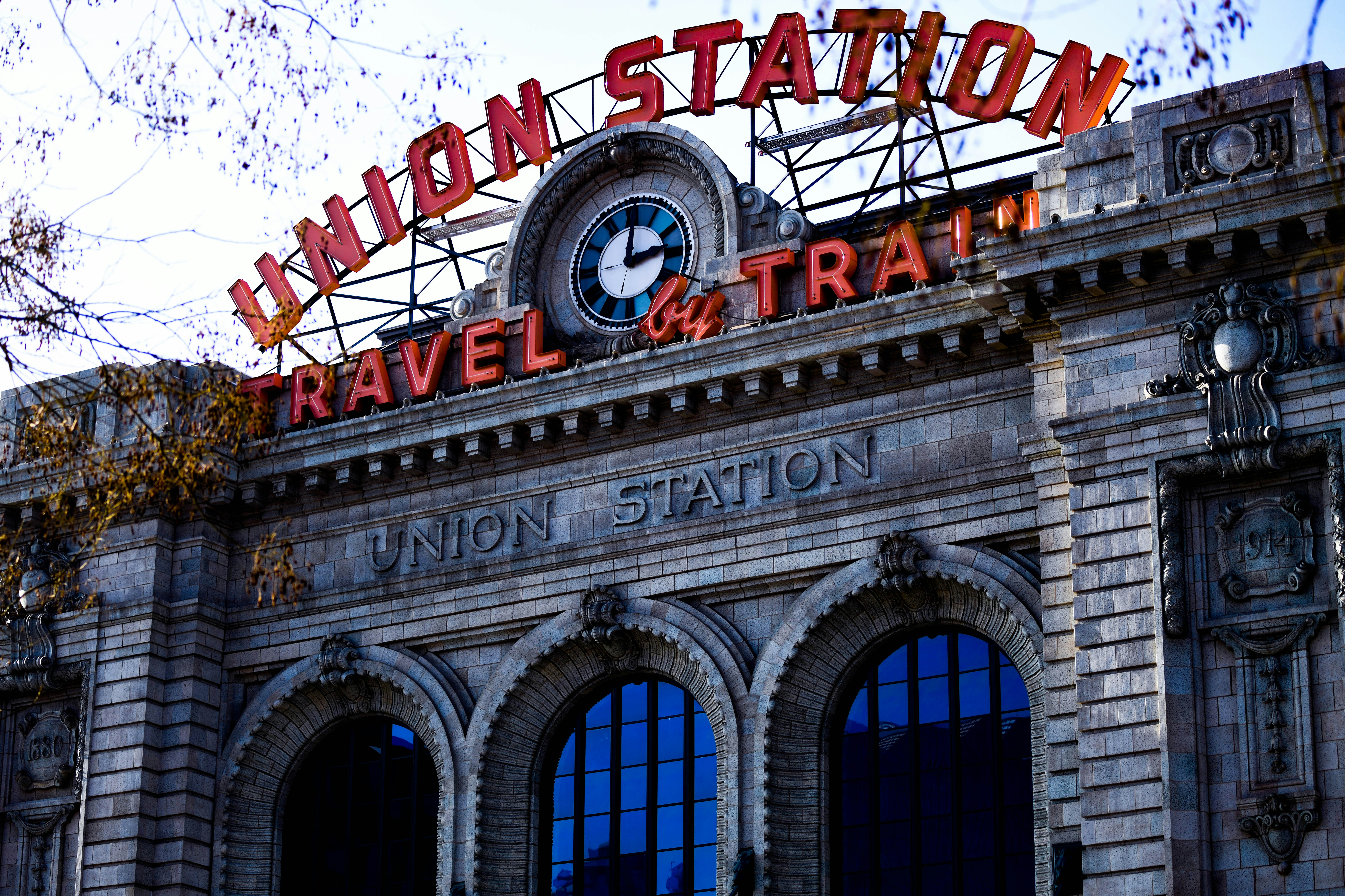 Historic Union Station facade featuring vintage signage and intricate architectural details. The structure showcases a blend of classic design and modern vibrancy.