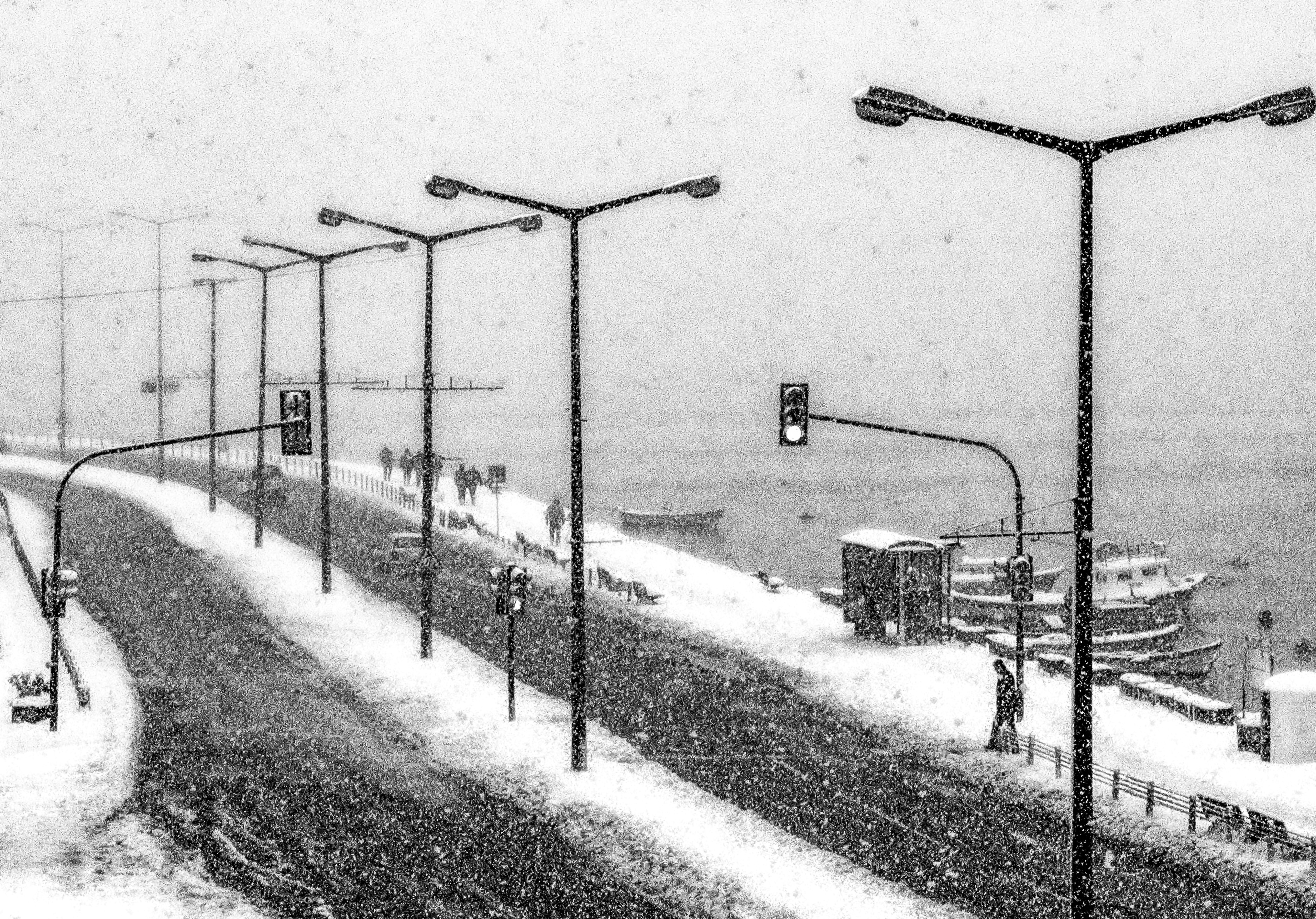 Snowbound Seafront Lane: Lamps, Boats, and a Quiet Harbor in Snow