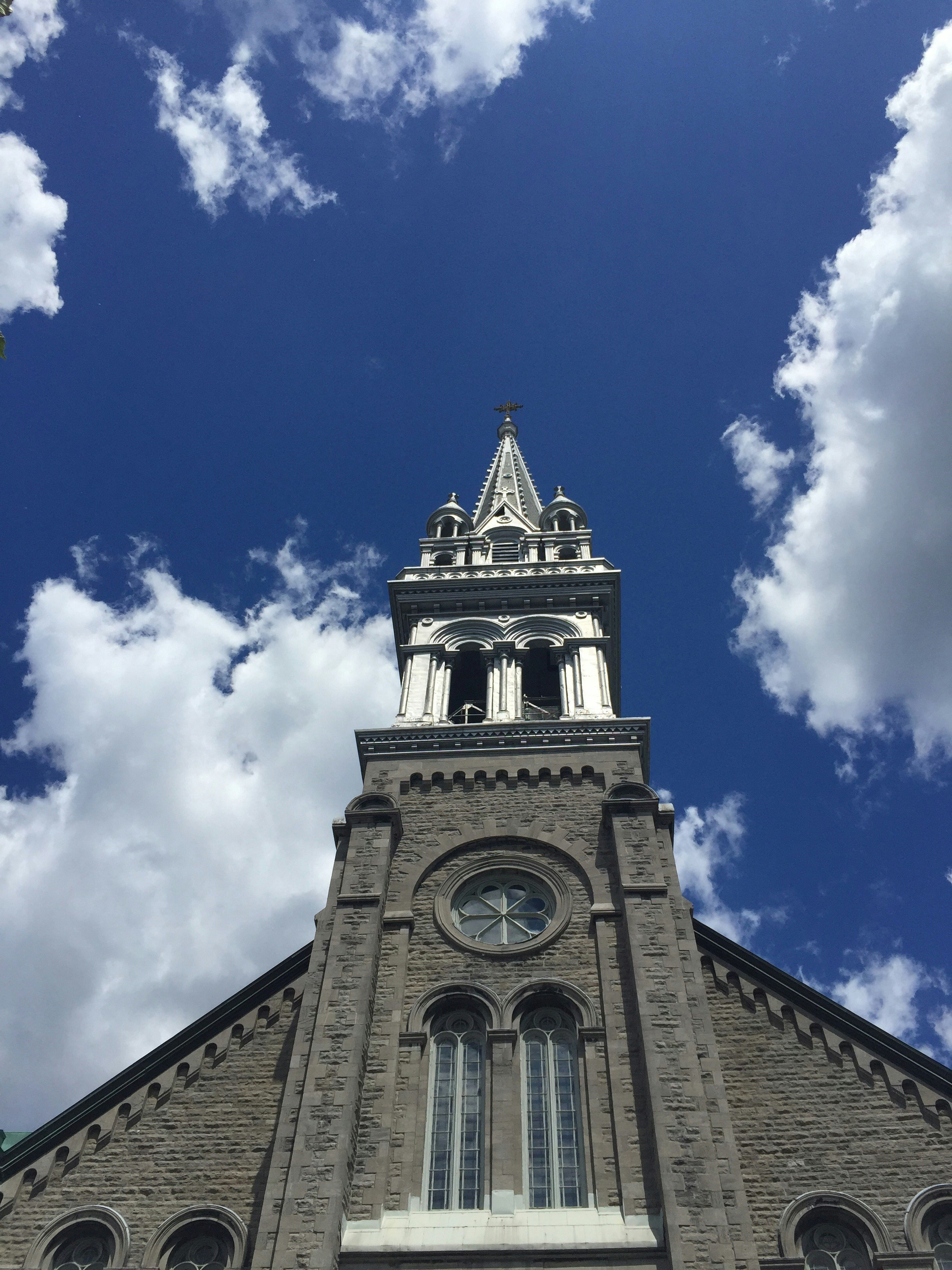 Spire Above the Blue: A Stone Tower Reaching Toward the Sky