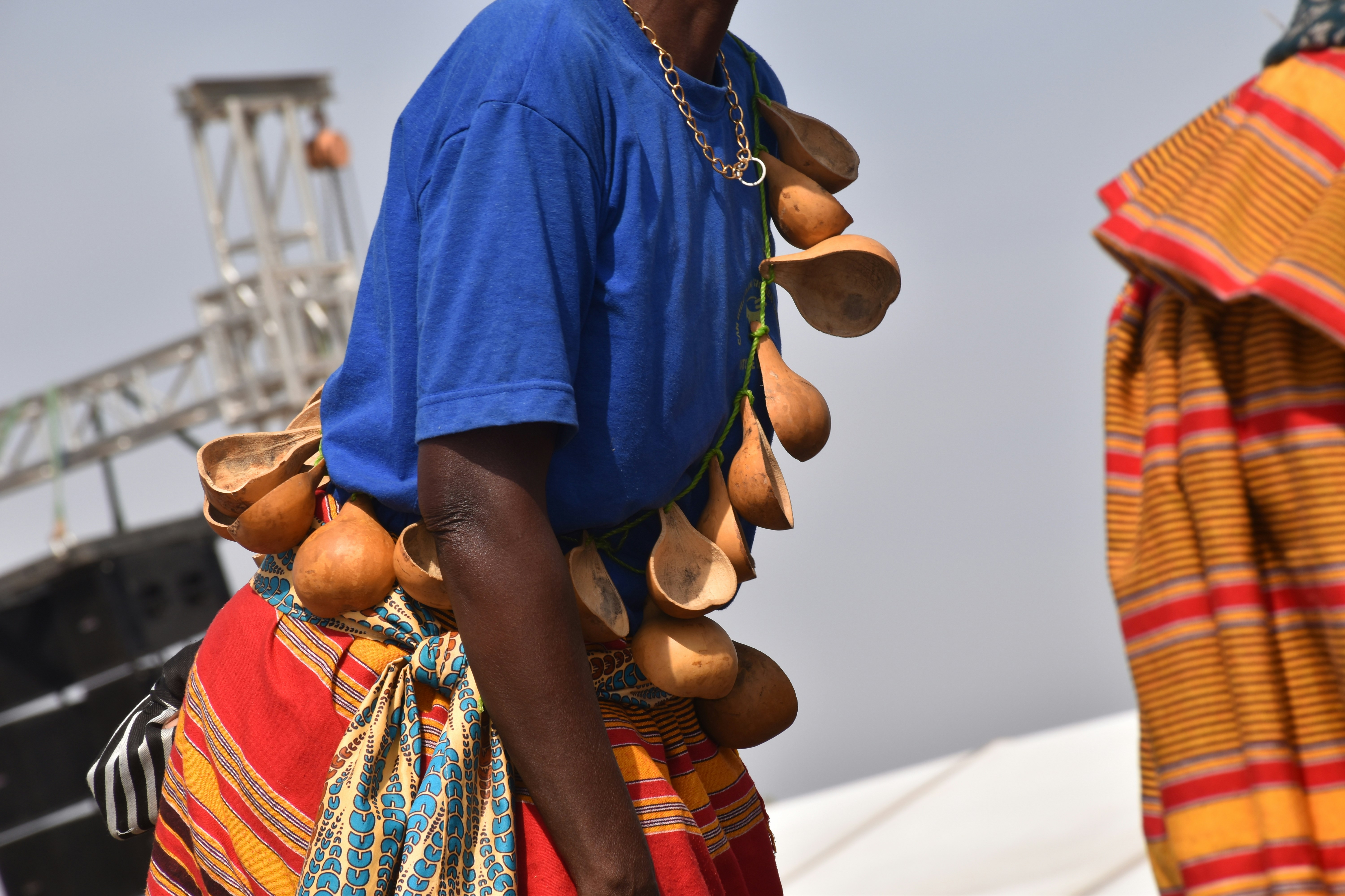 Calabash Adornments and Colorful Drapery at a Street Festival