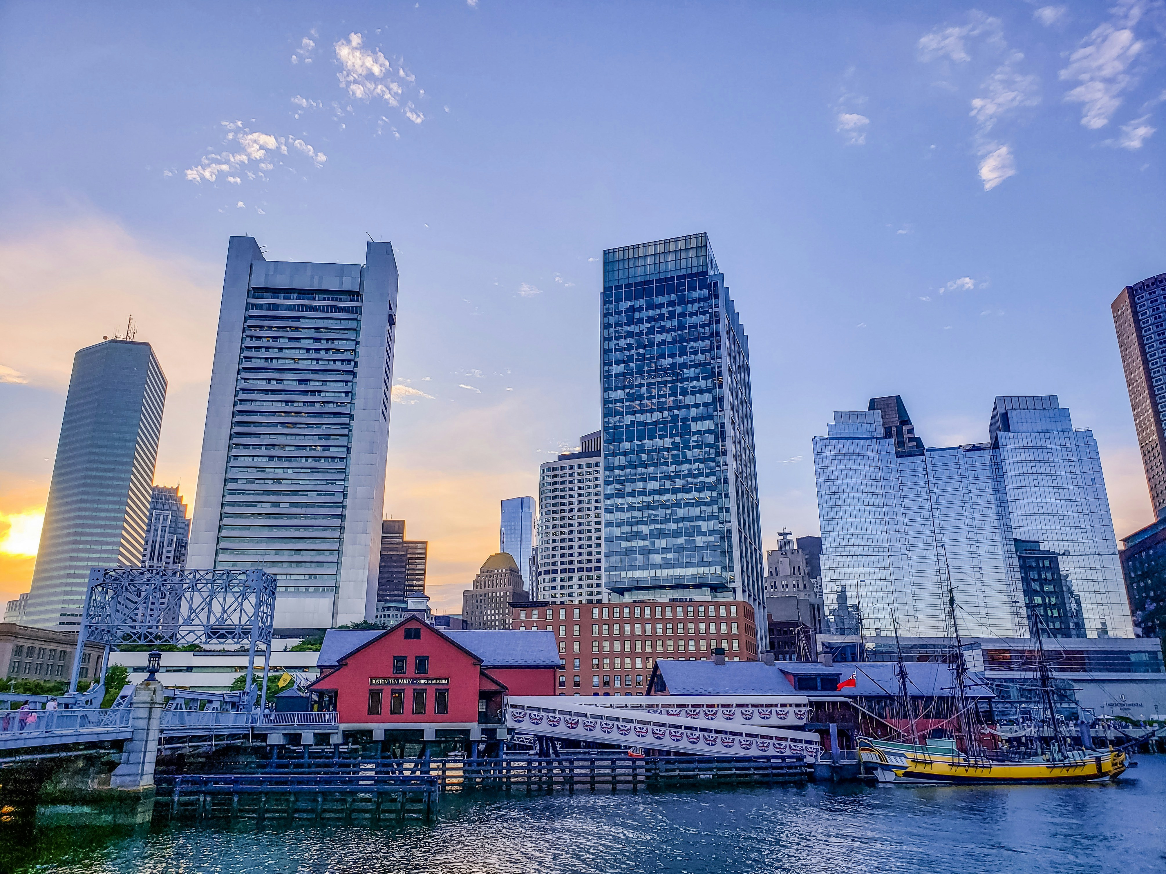High rise building near body of water under white sky photo – Free City ...