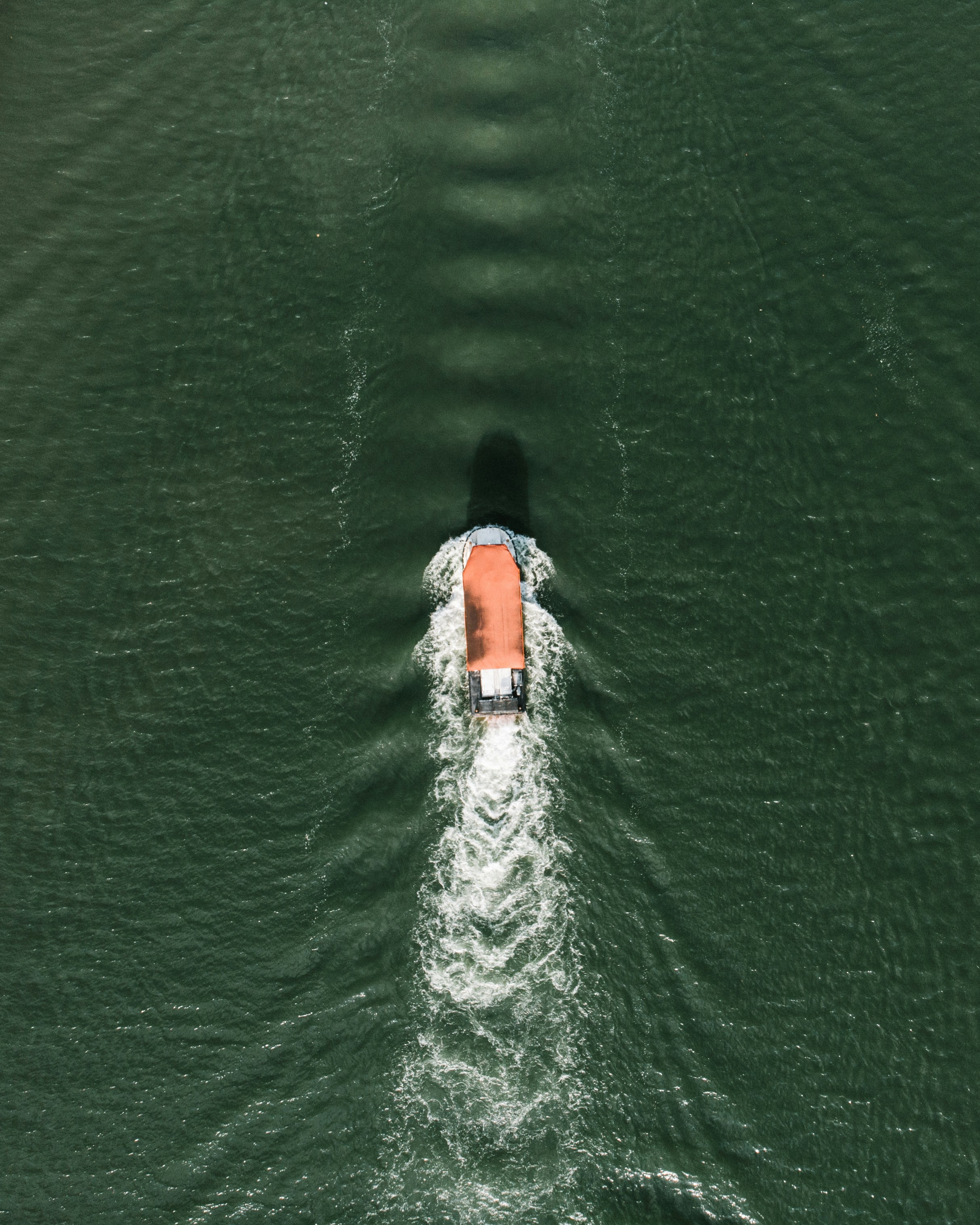 boat cruising in the middle of the sea