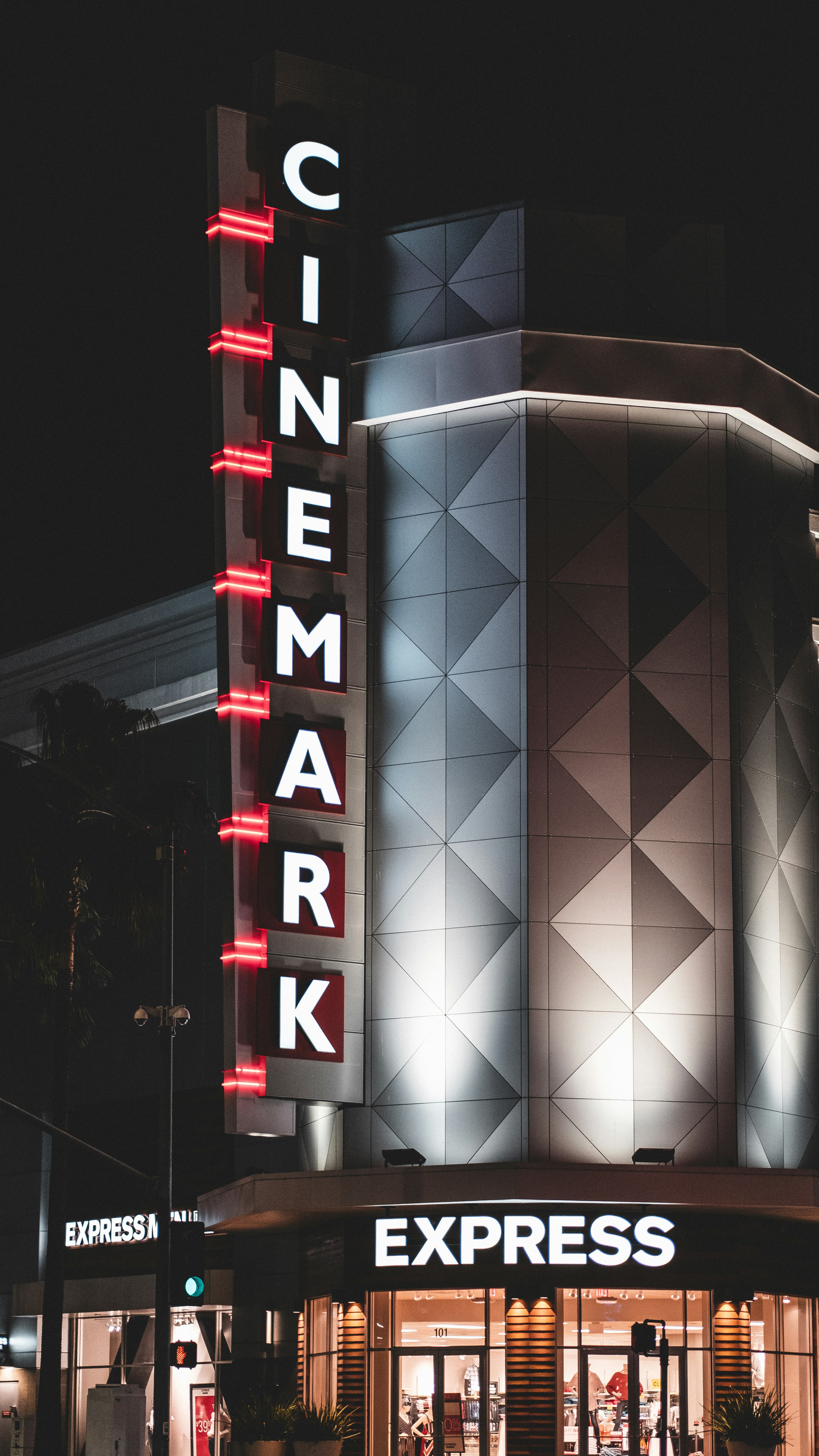 Neon Cinema: Night Lights on a Modern Facade