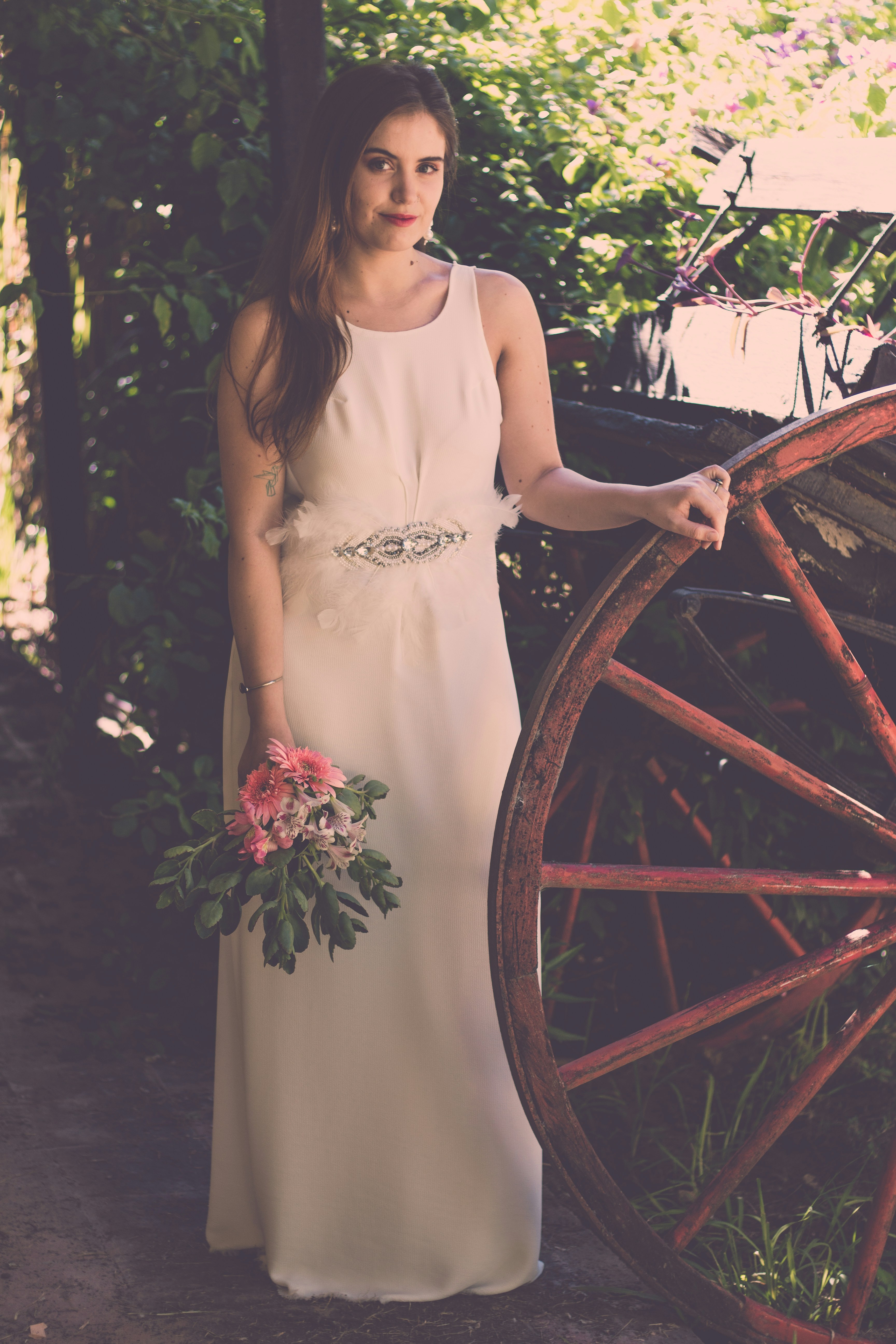 Ivory Gown by the Wheel: A Quiet Garden Portrait