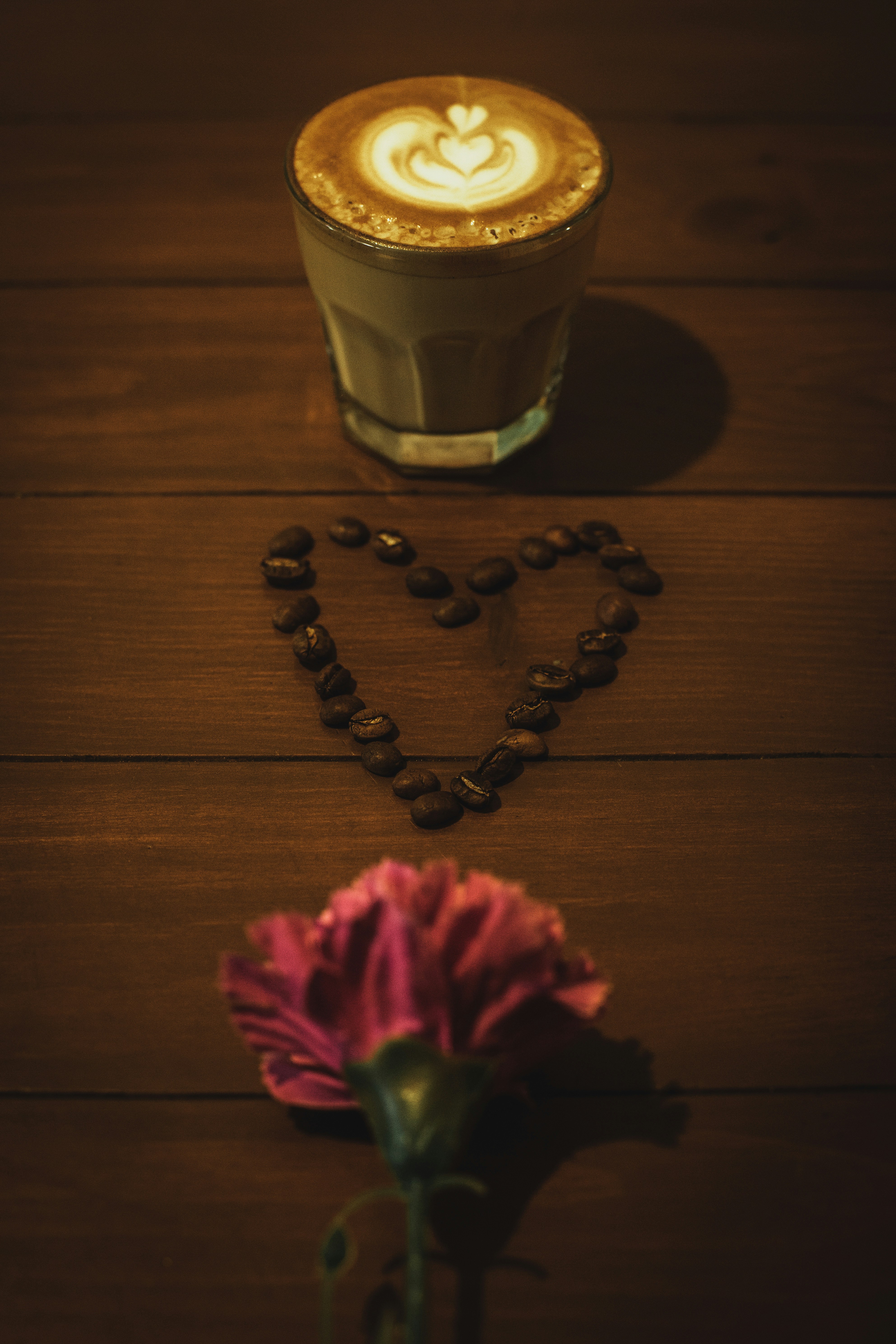 Heart of Warmth: Latte Art, Bean Heart, and a Pink Carnation