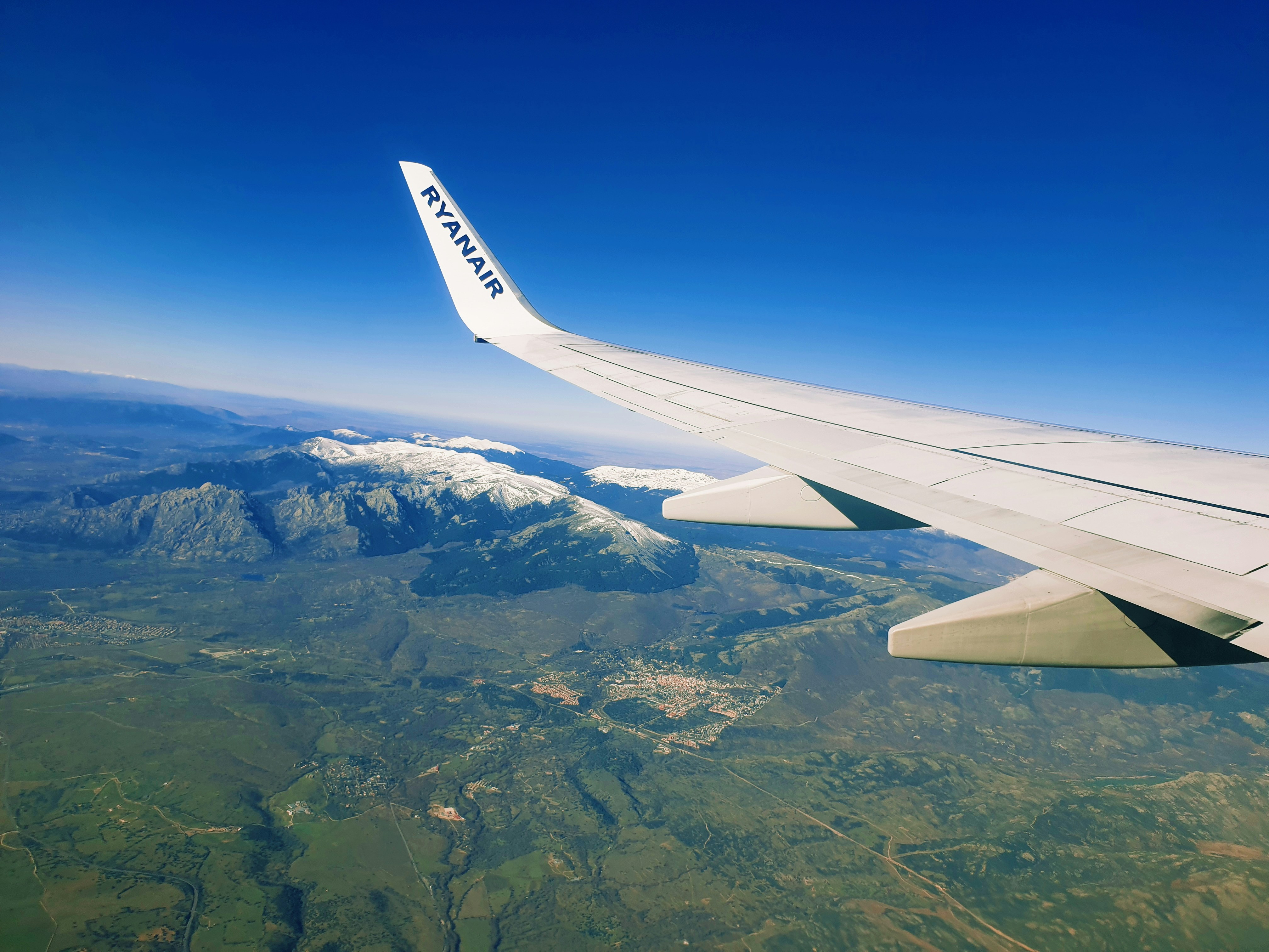 Ryanair Wing over Azure Sky and Emerald Valleys