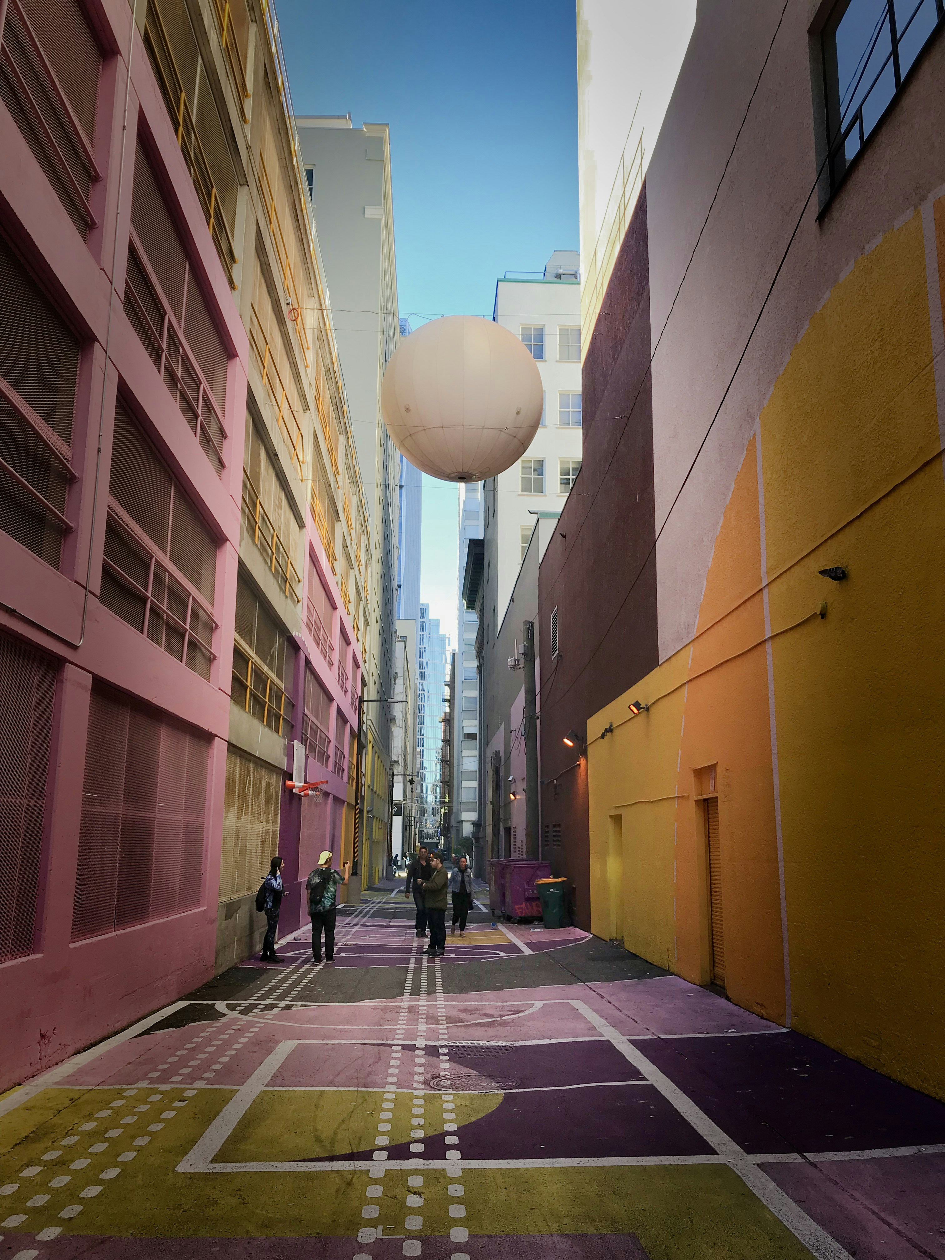 Floating Sphere Over a Prism Alley