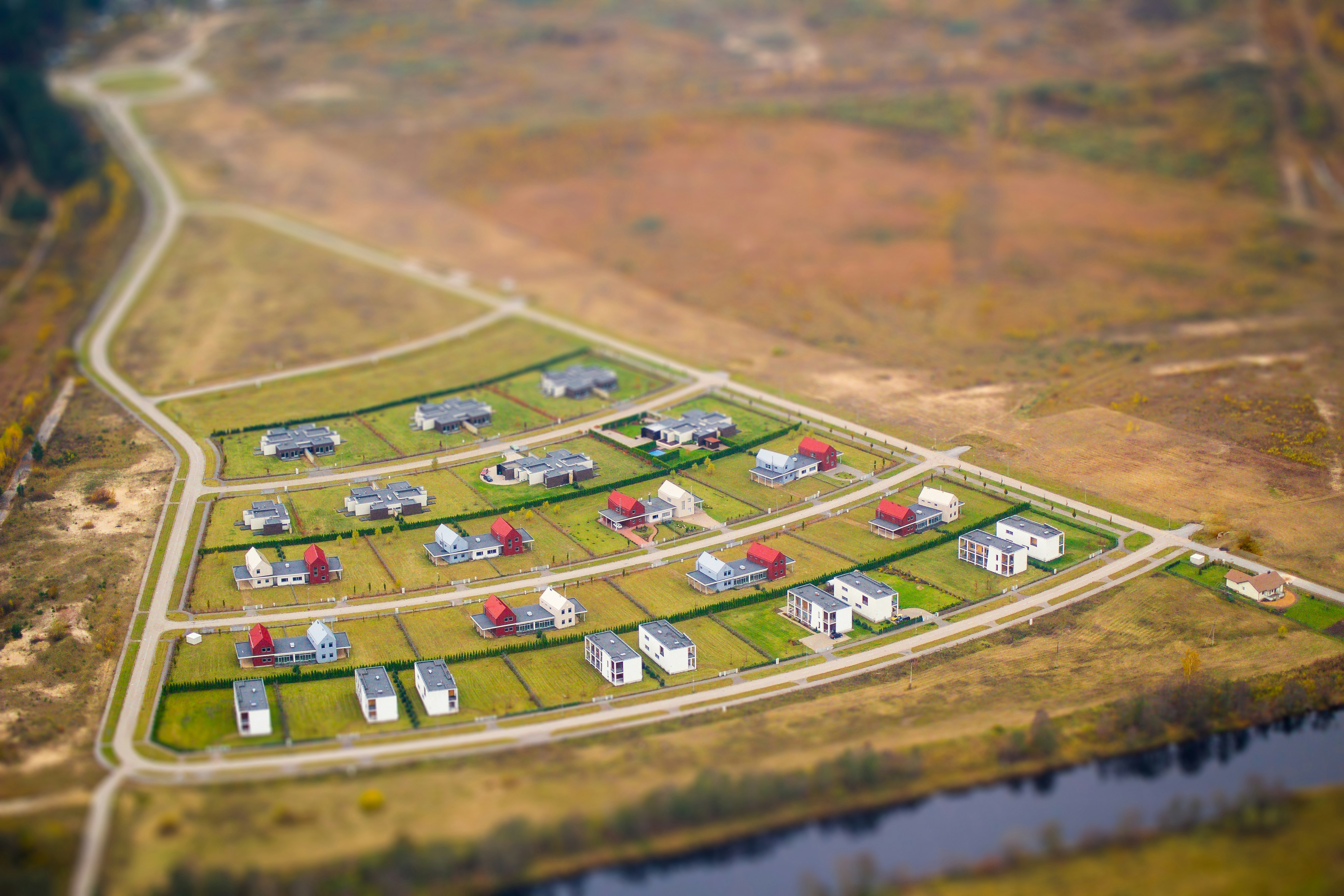 Tilt-shift effect transforms a suburban neighborhood into a diorama with vivid colors and precise lines.
