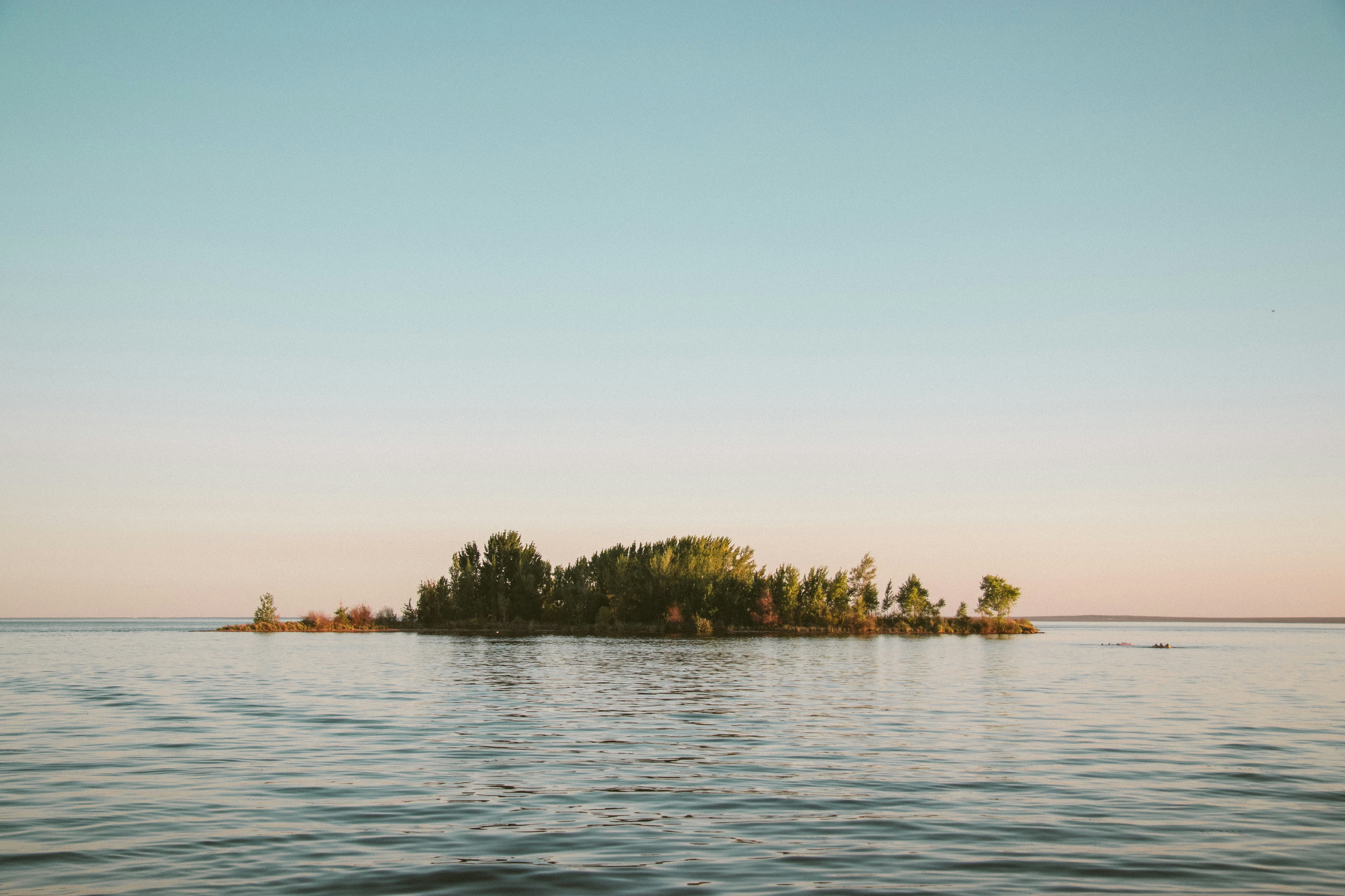 Islet at middle of sea photo – Free Sunset Image on Unsplash