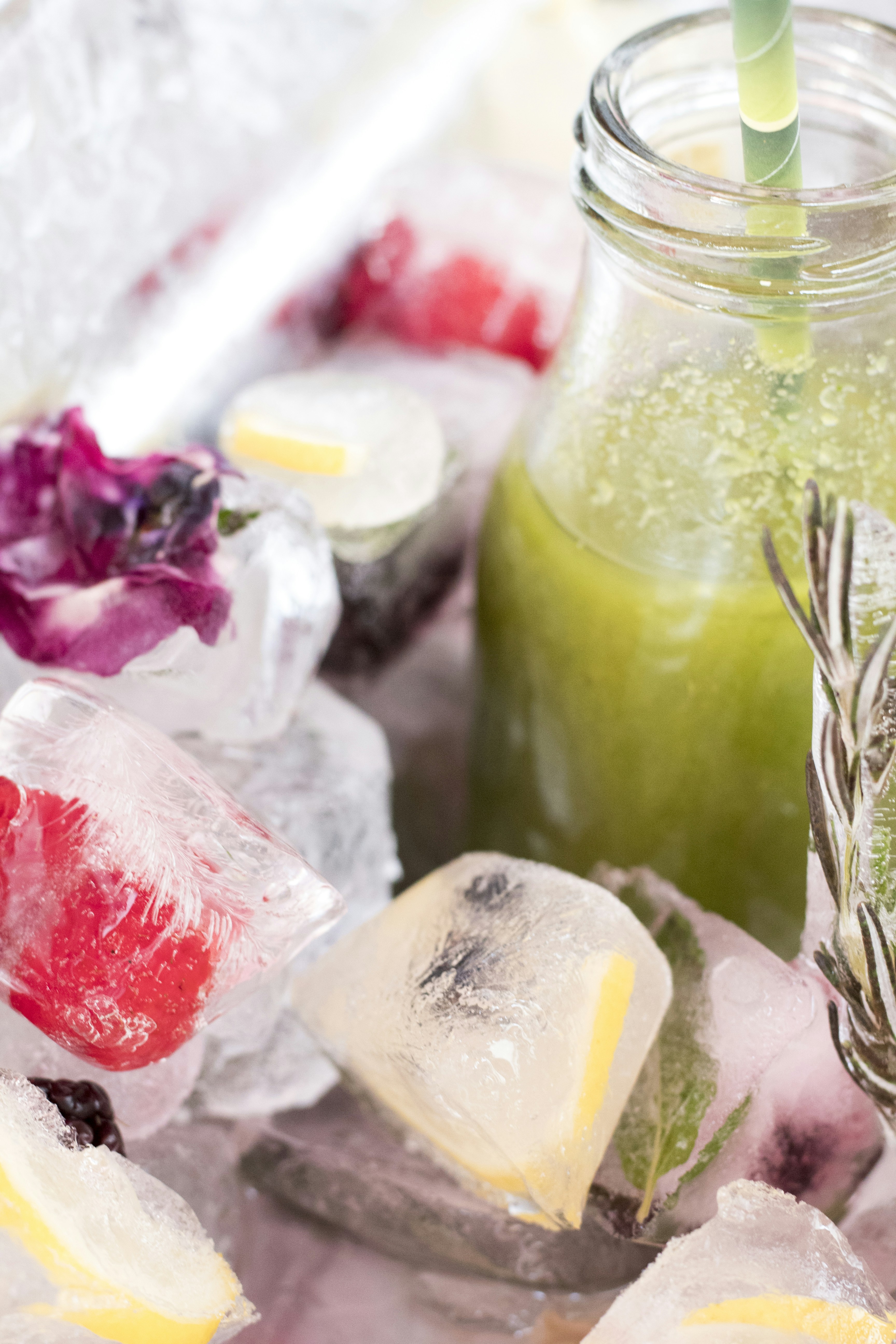 Lemon-Infused Green Juice Amid Ice and Botanicals