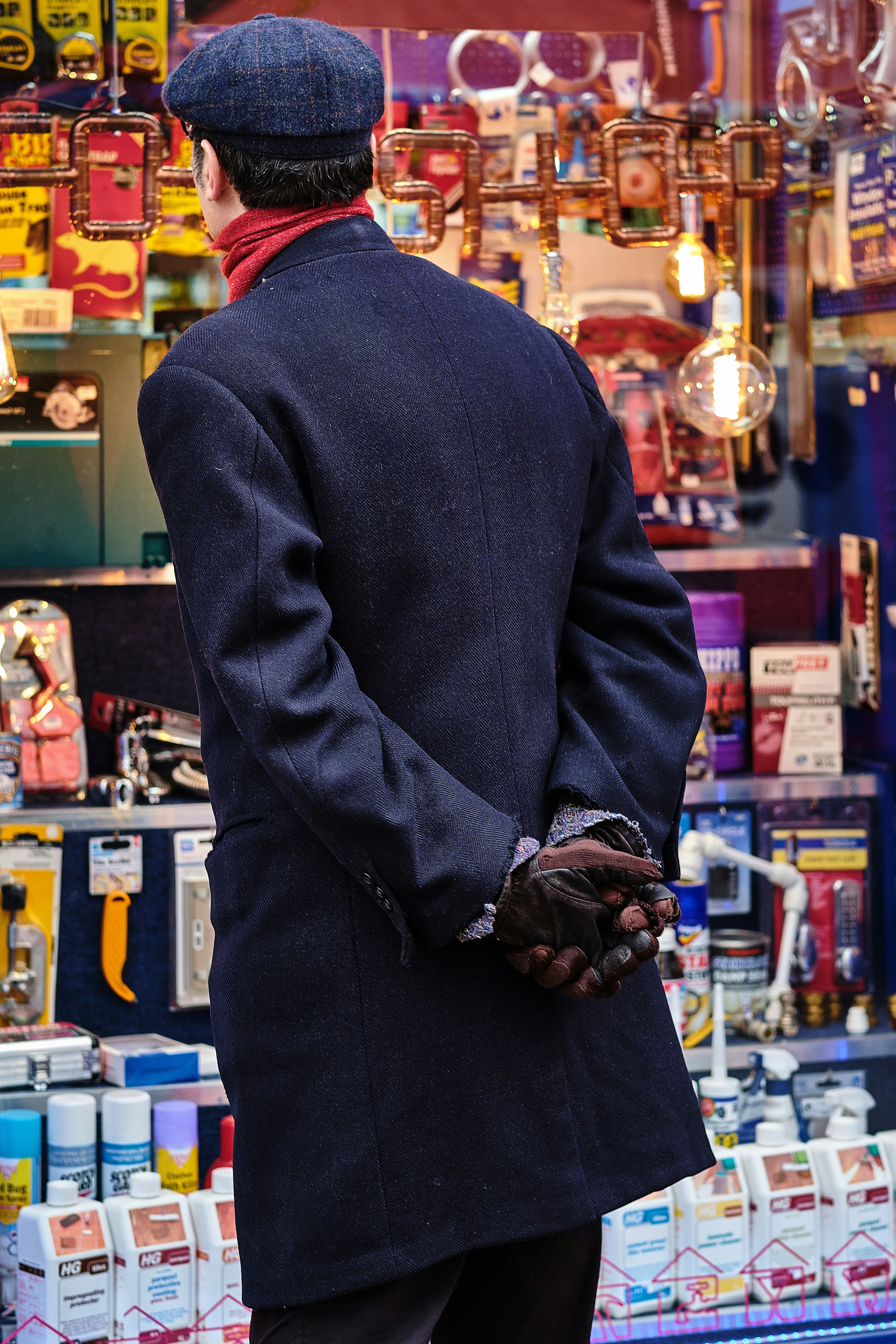 Man staring at the store behind glass wal photo – Free Shelf Image on ...