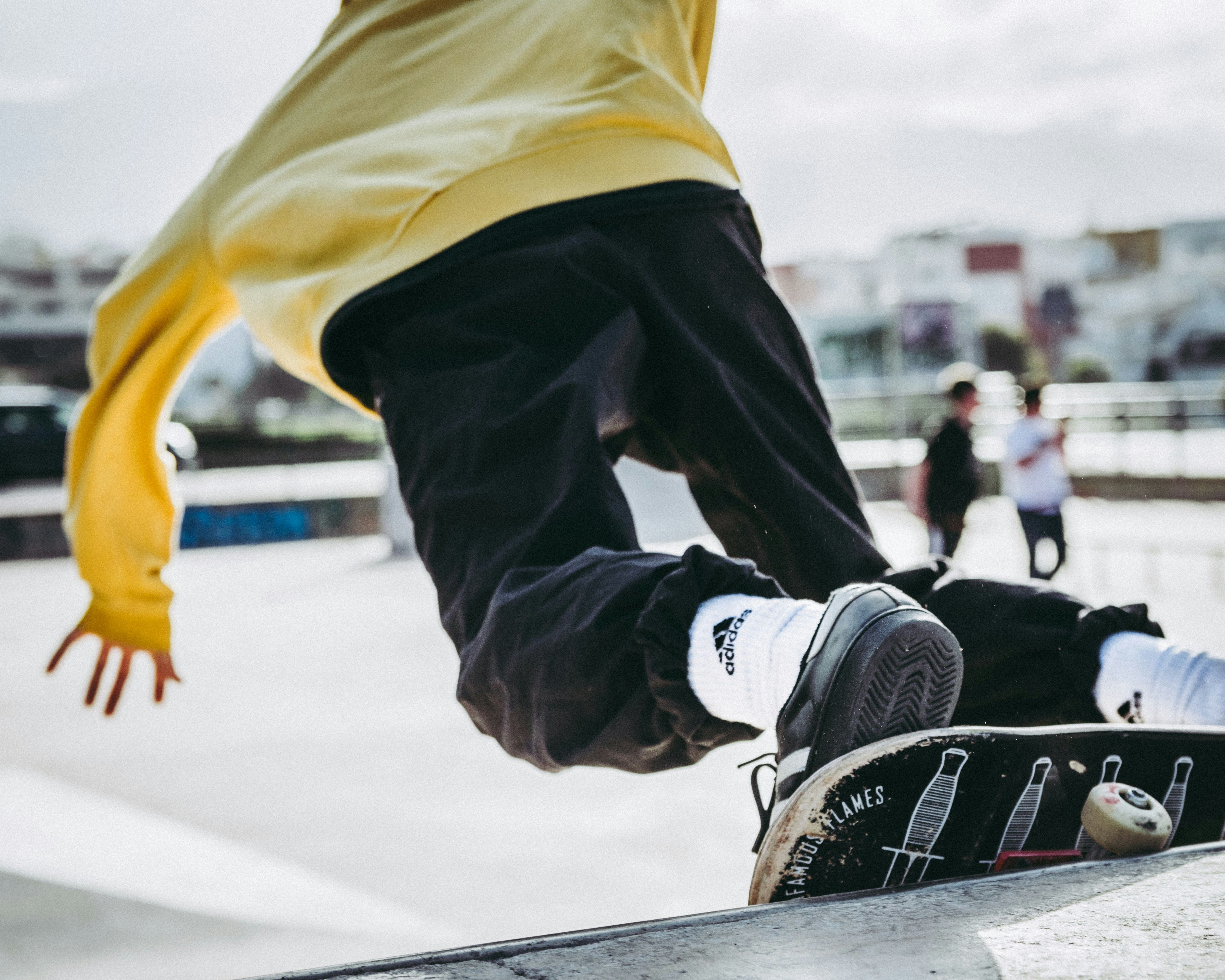 man riding black and white skateboard