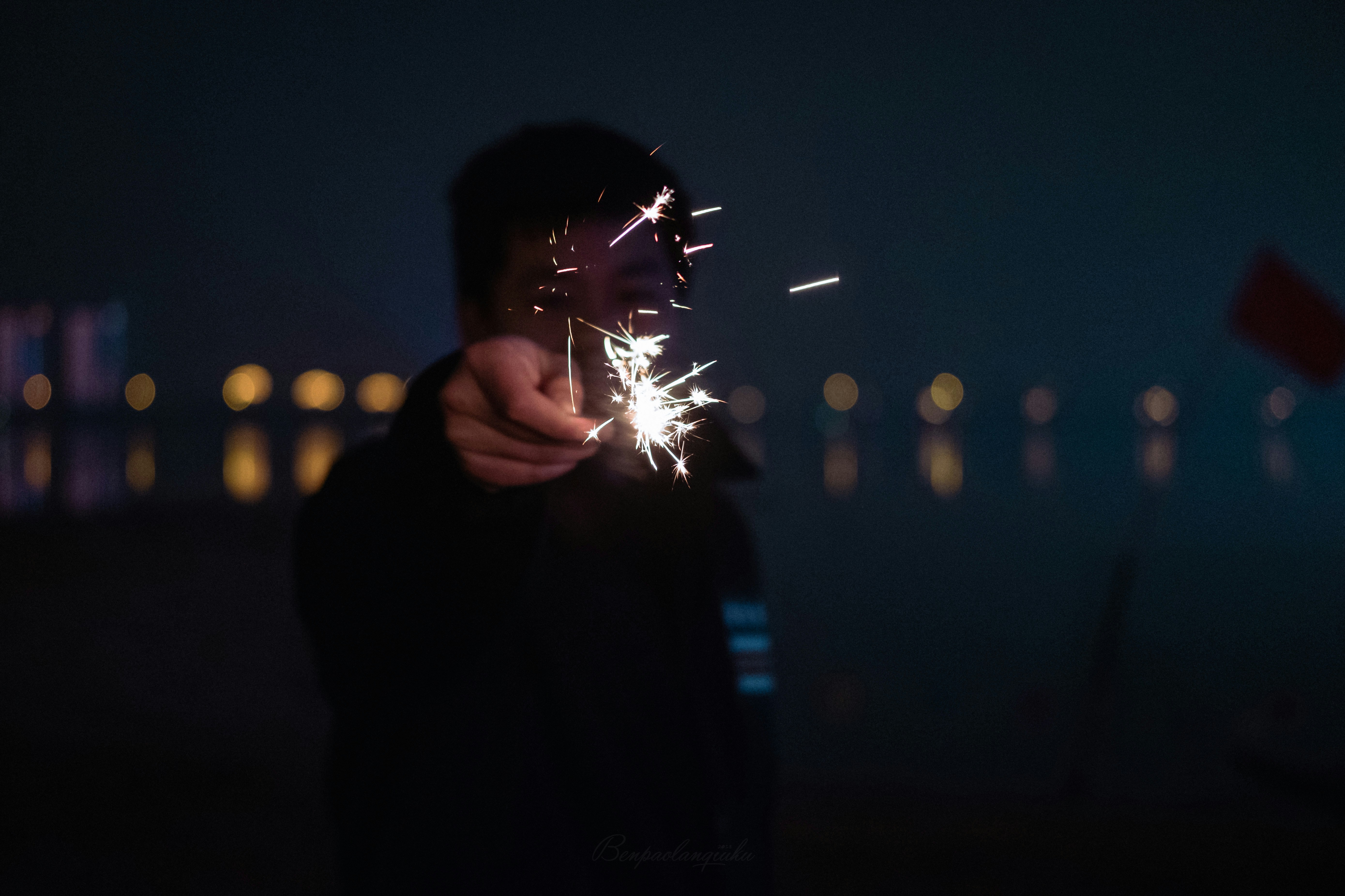 Man holding fireworks photo – Free Person Image on Unsplash