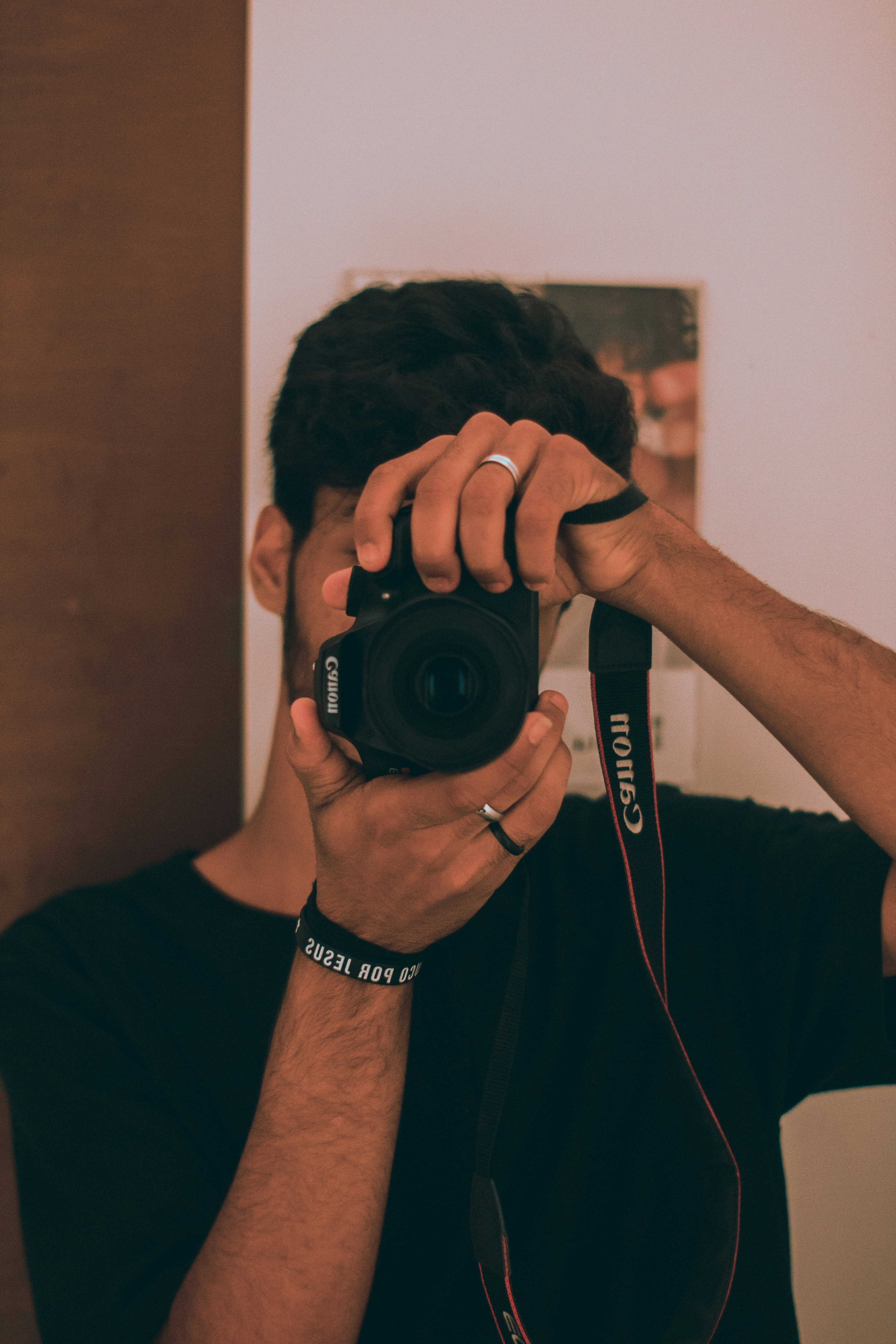 Man holding black Canon DSLR camera photo – Free Human Image on Unsplash