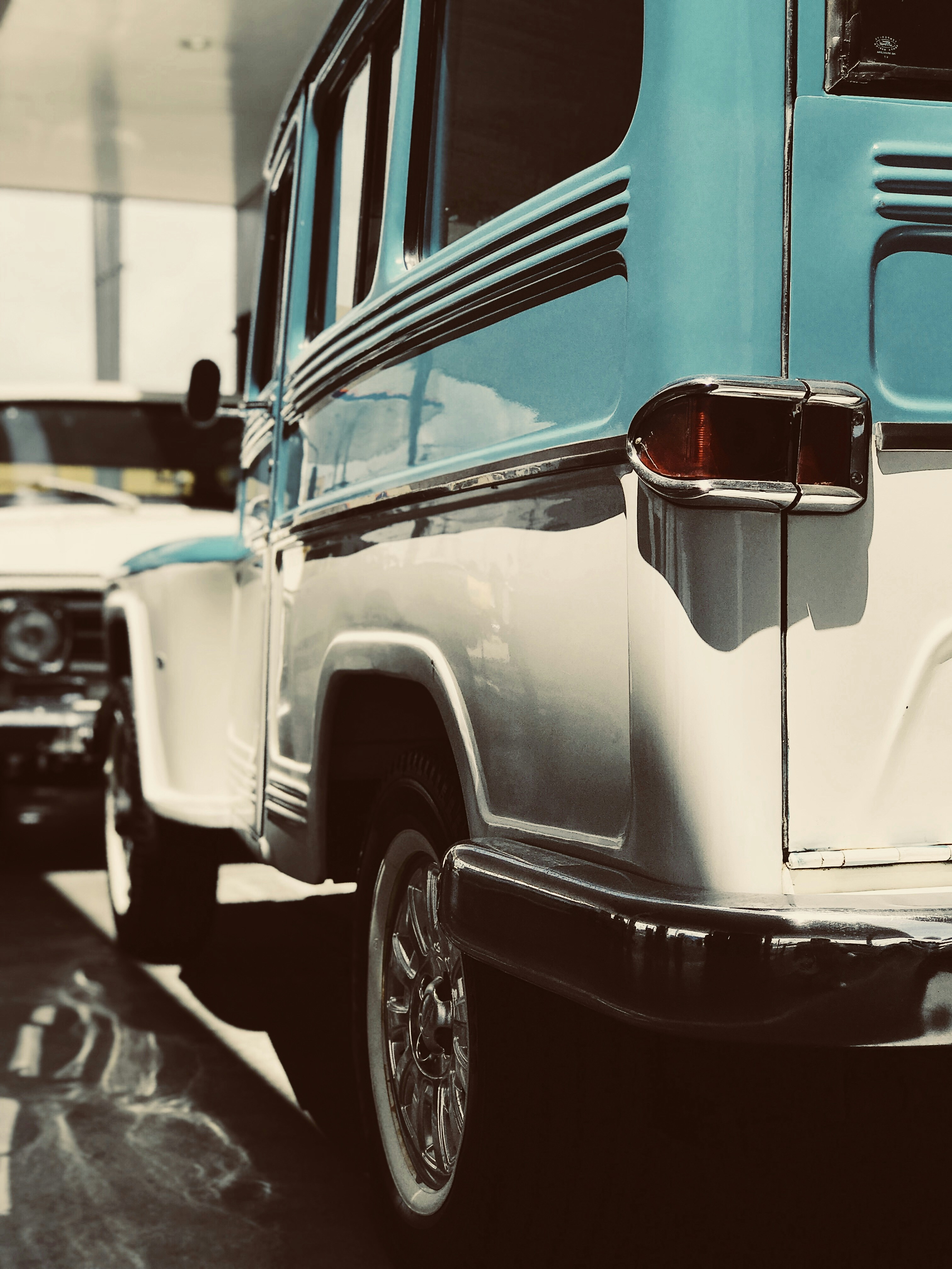 Classic vintage vehicle showcasing its gleaming body and distinctive design elements. The scene captures the nostalgia of a bygone automotive era.