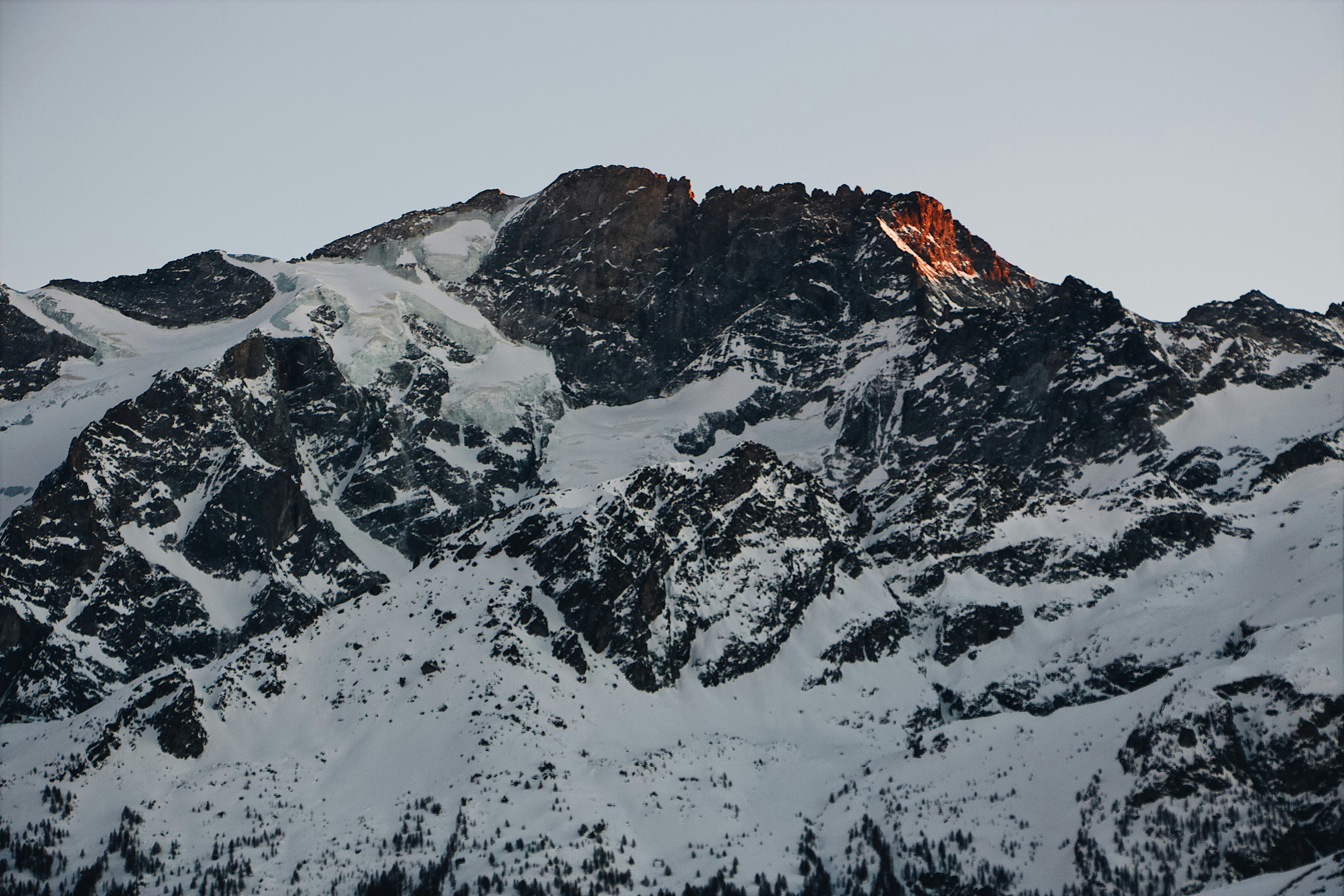 Crimson Crest: sunlit peak on a jagged alpine ridge