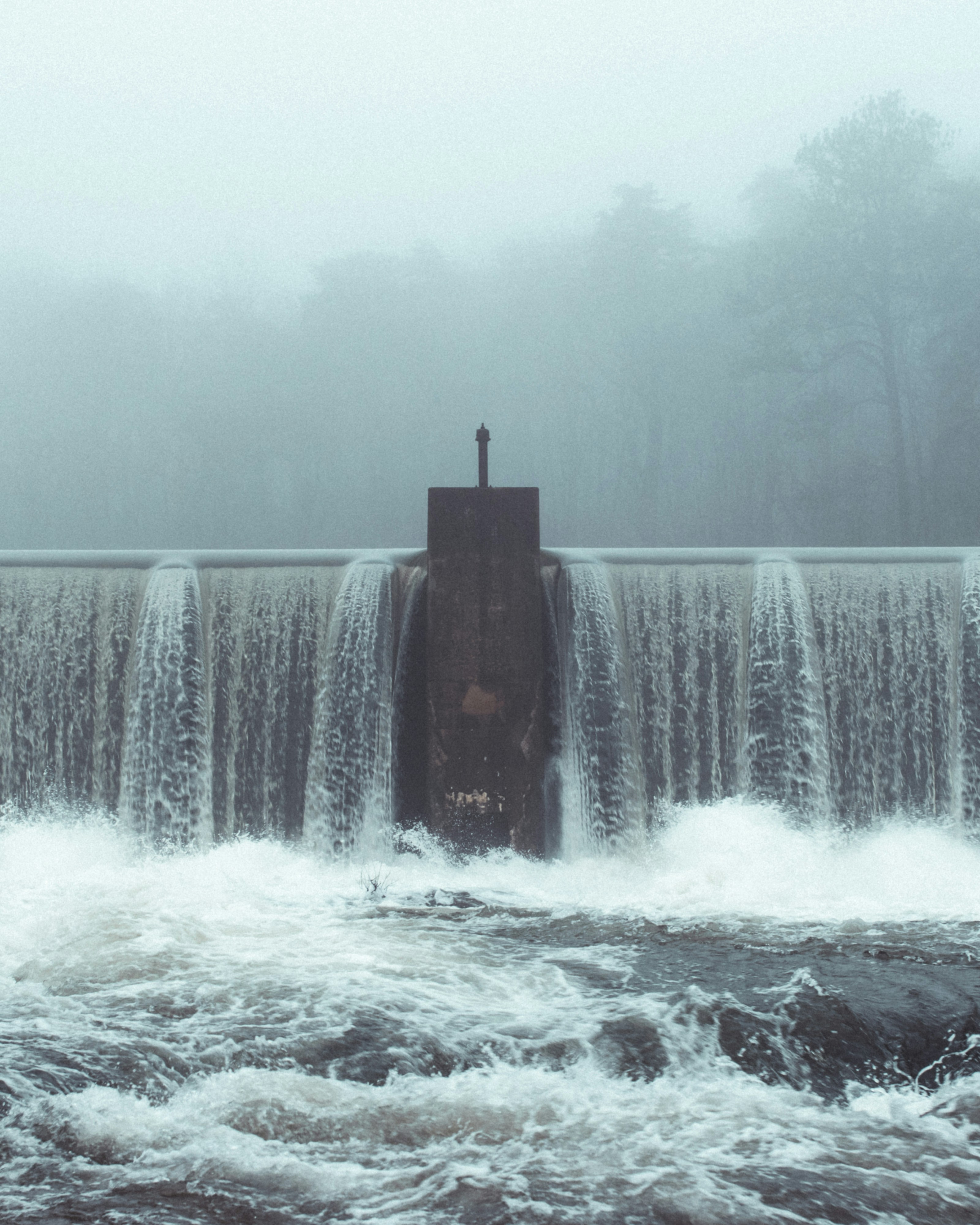Central Pillar in Mist: Quiet Power Over the Spillway