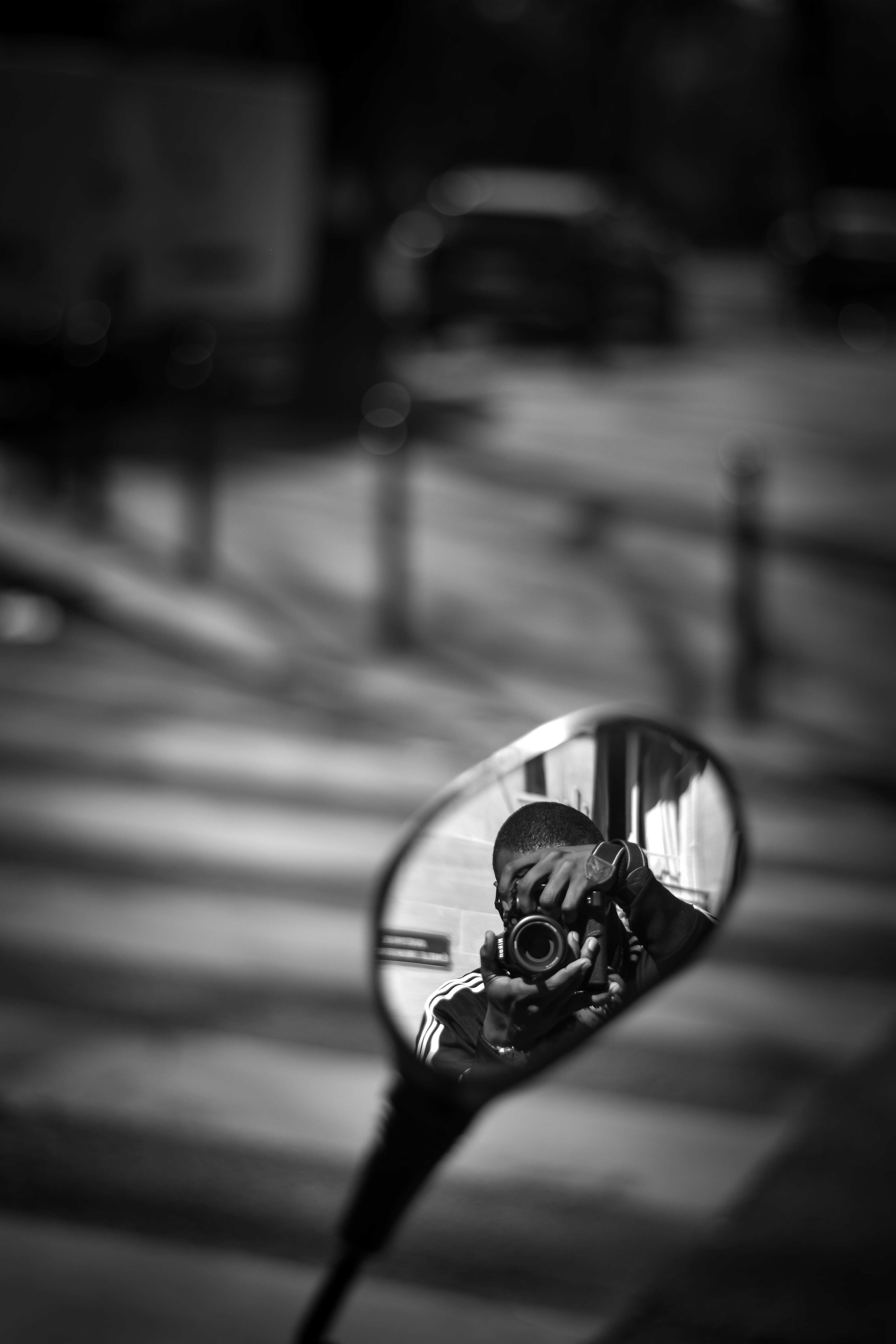 Selective focus photography of person taking picture at side mirror ...