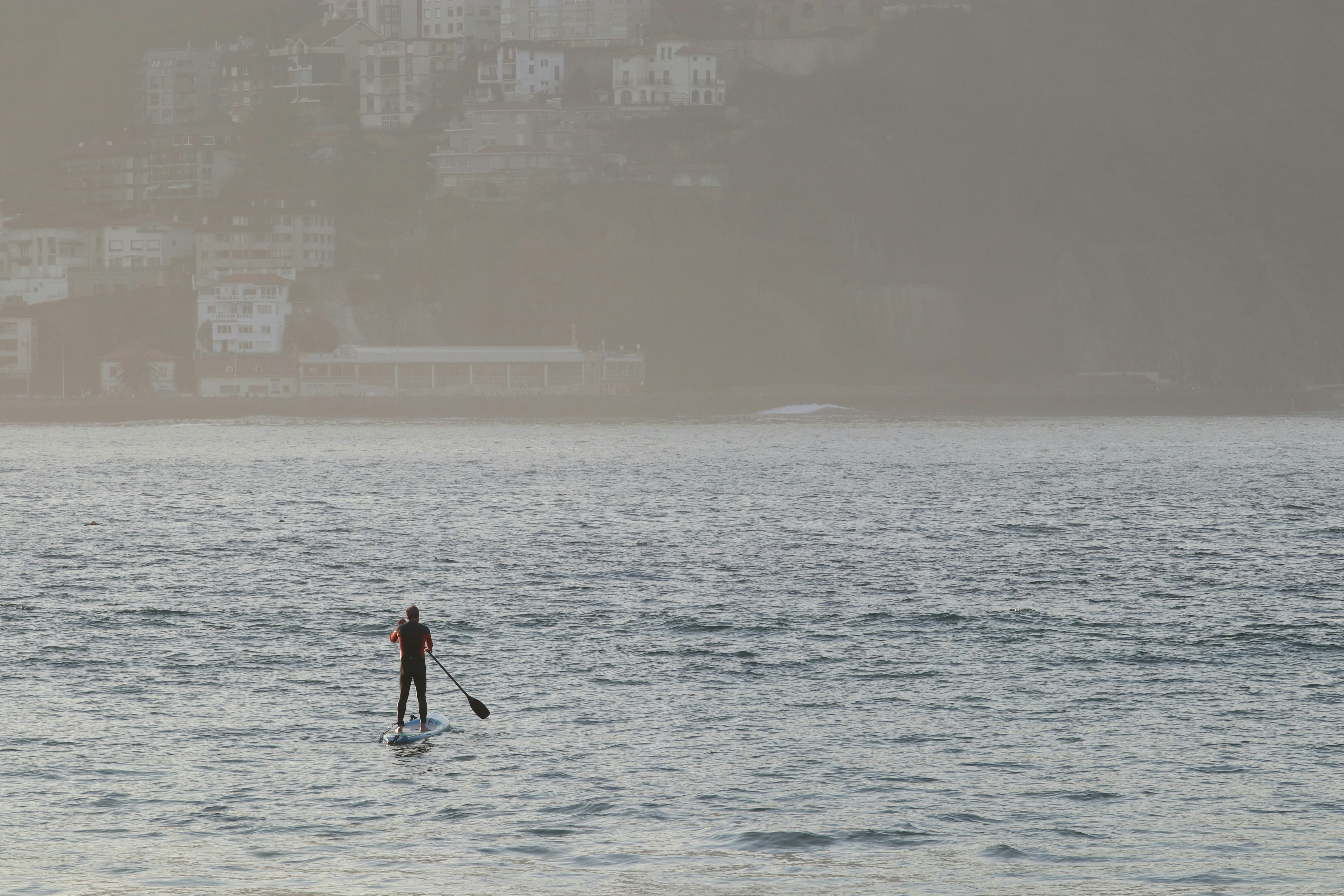 Solitary Paddle on Misty Waters