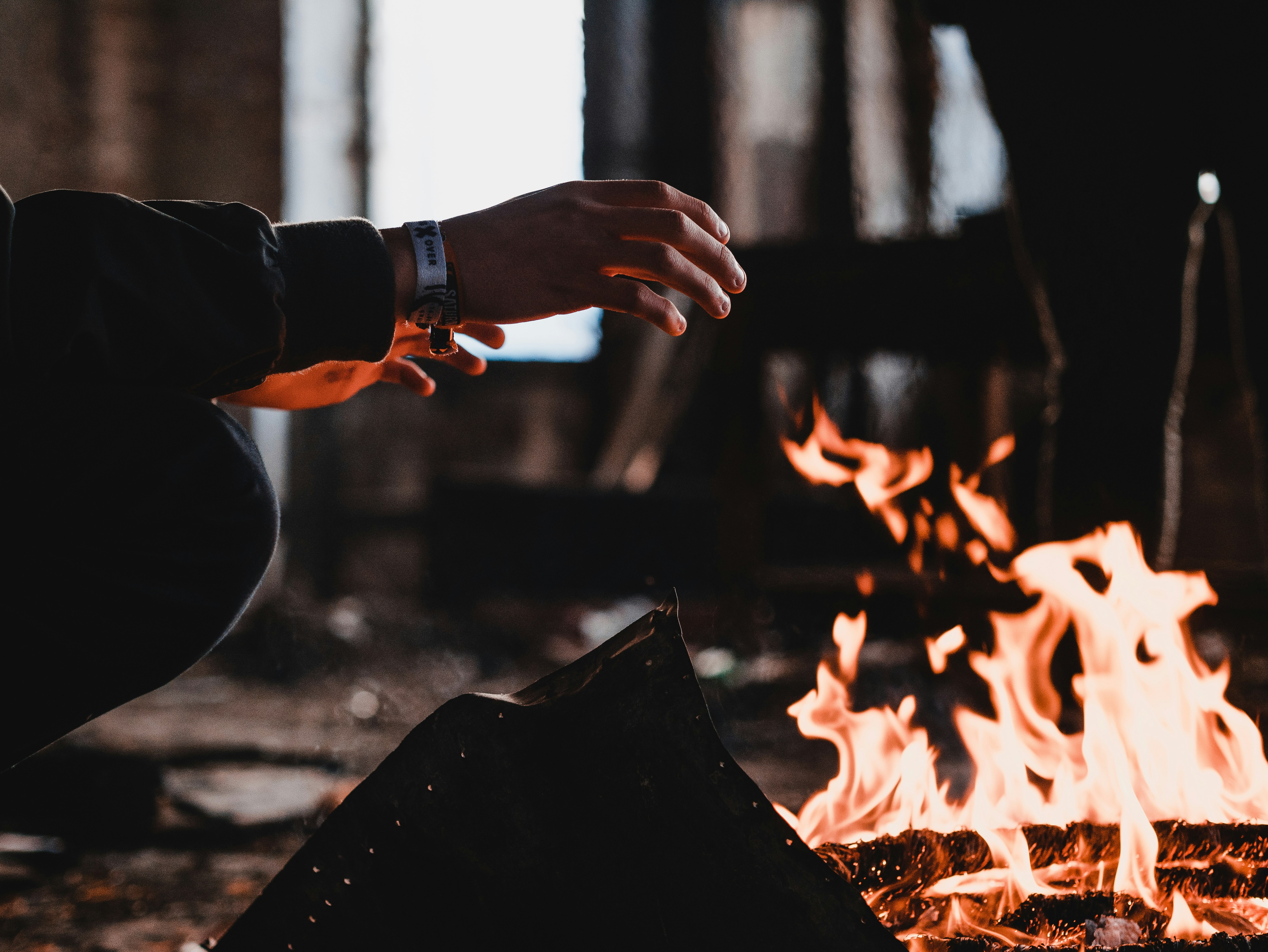 Hovering Ember: Quiet Hands Meet a Flickering Campfire