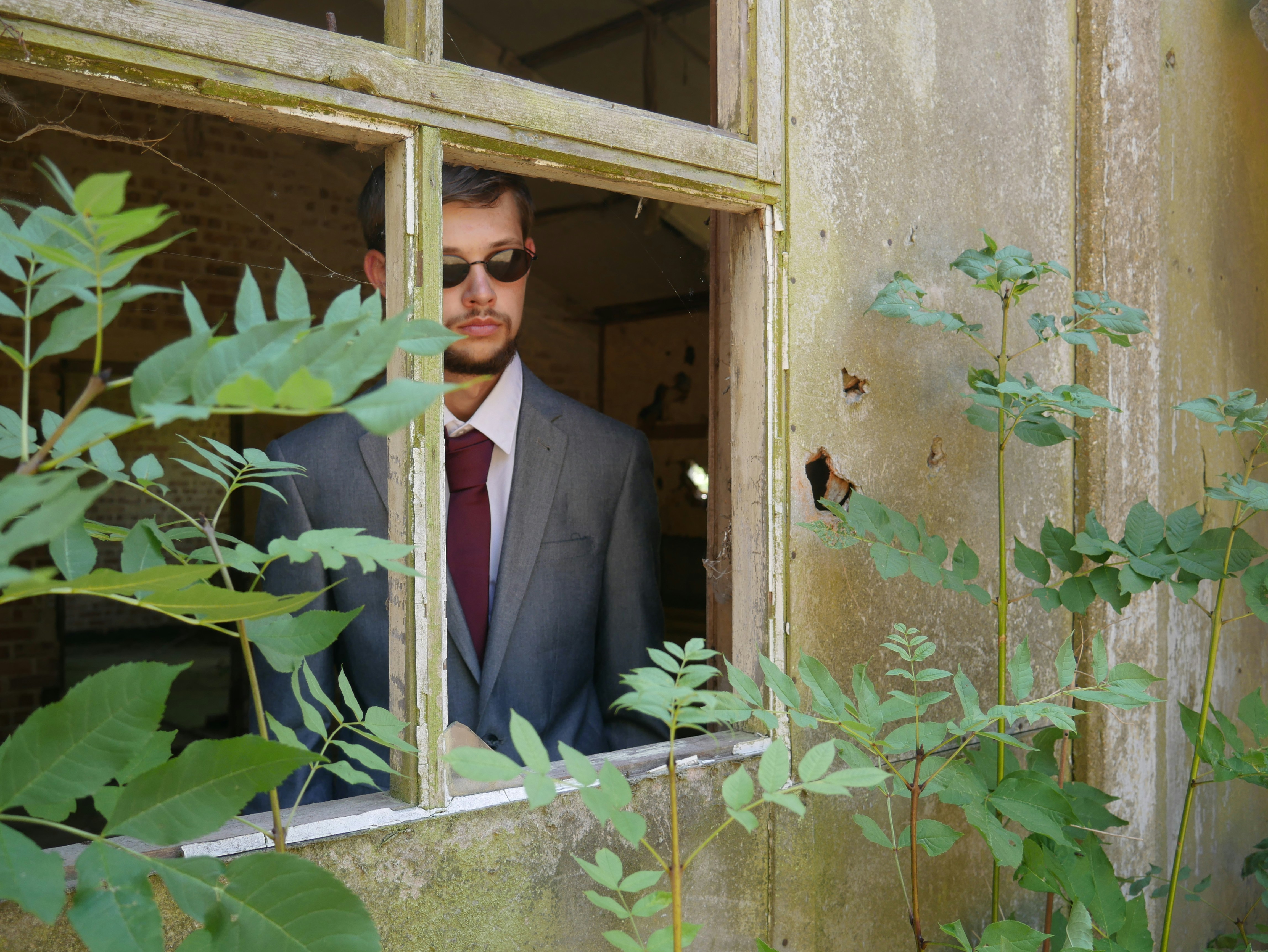 Man in glasses beside window photo – Free Apparel Image on Unsplash