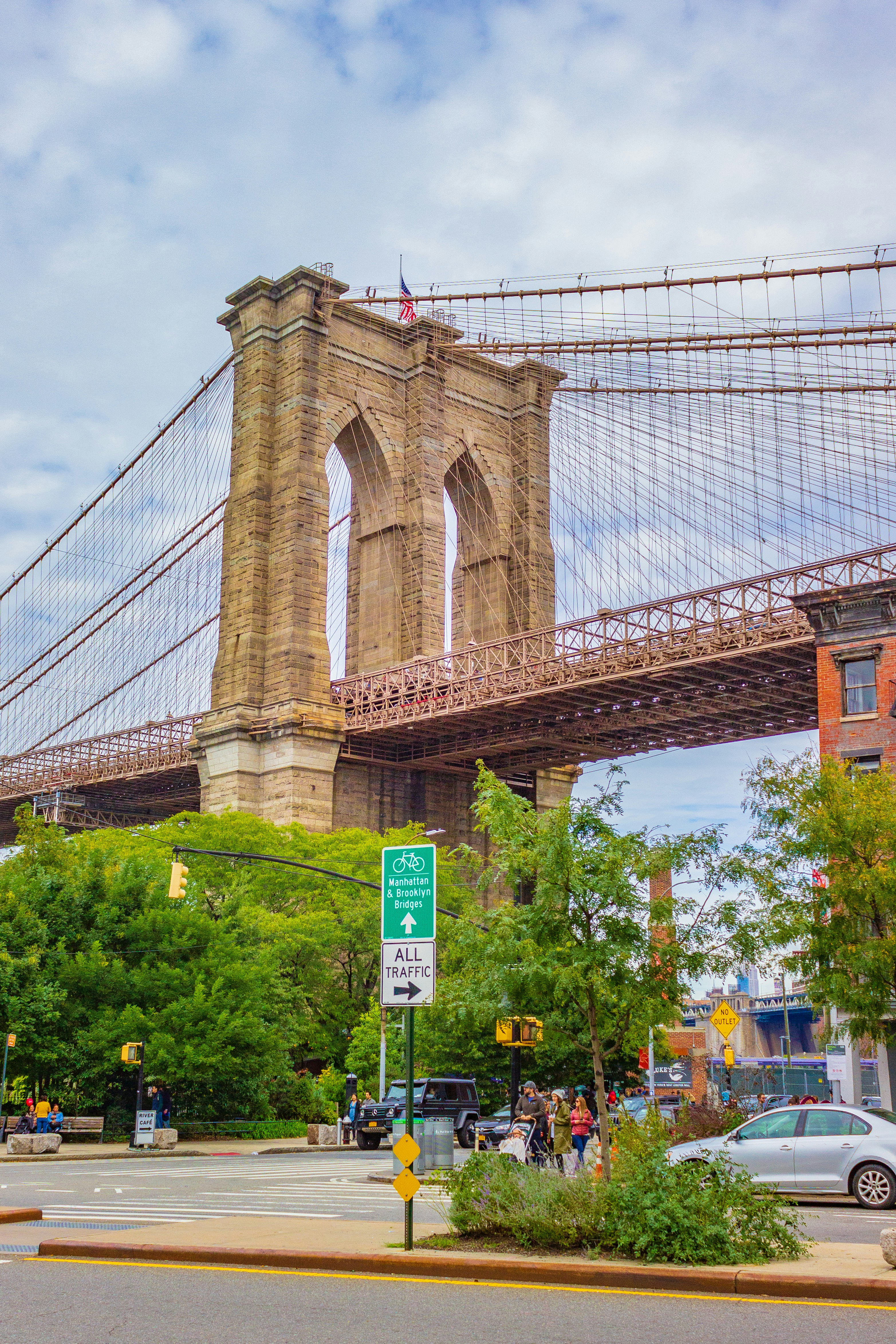 Tower and Cables: Brooklyn Bridge Framed by Riverside Street Life