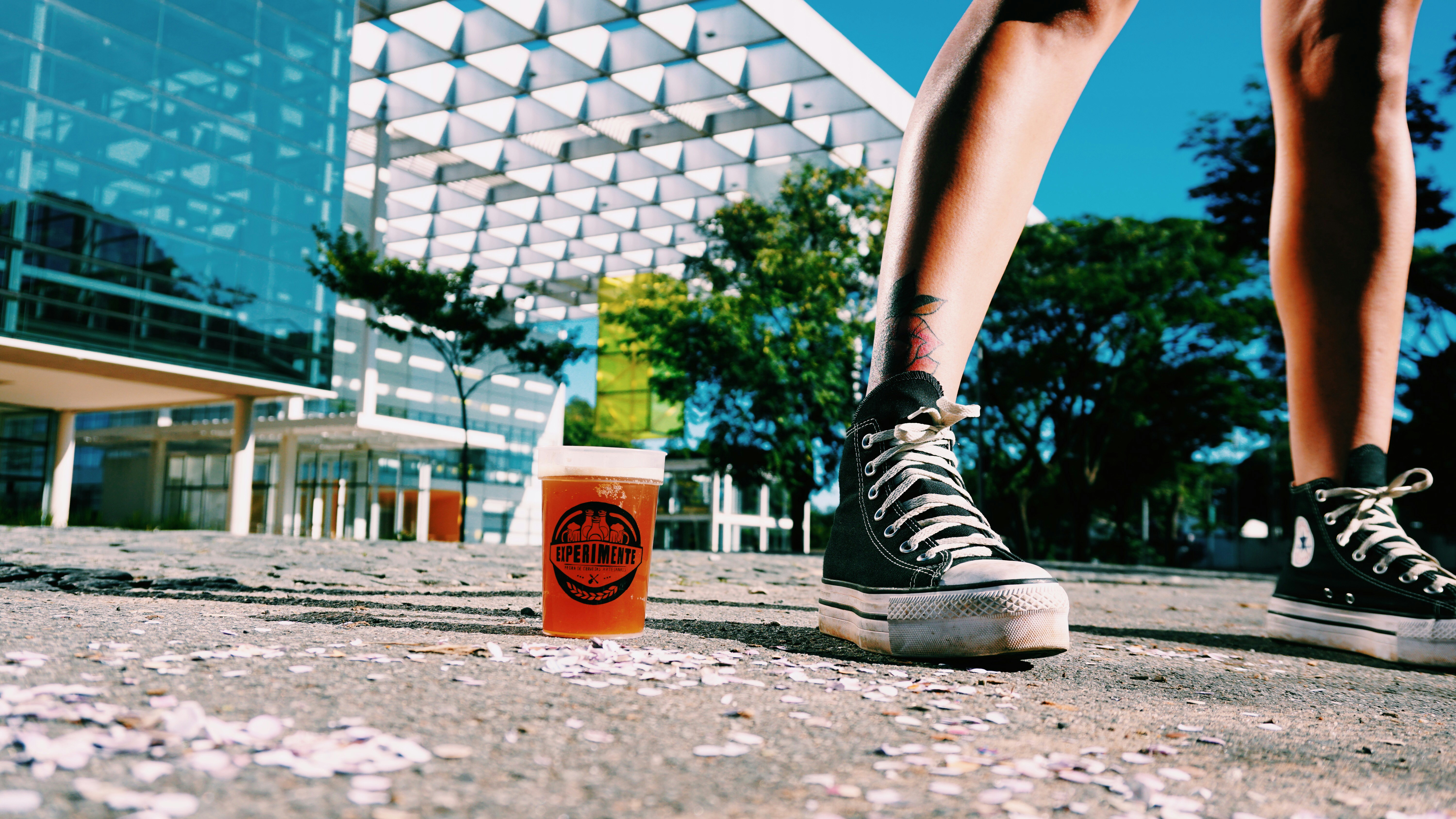 Amber Cup on Concrete: A Sunlit Campus Moment