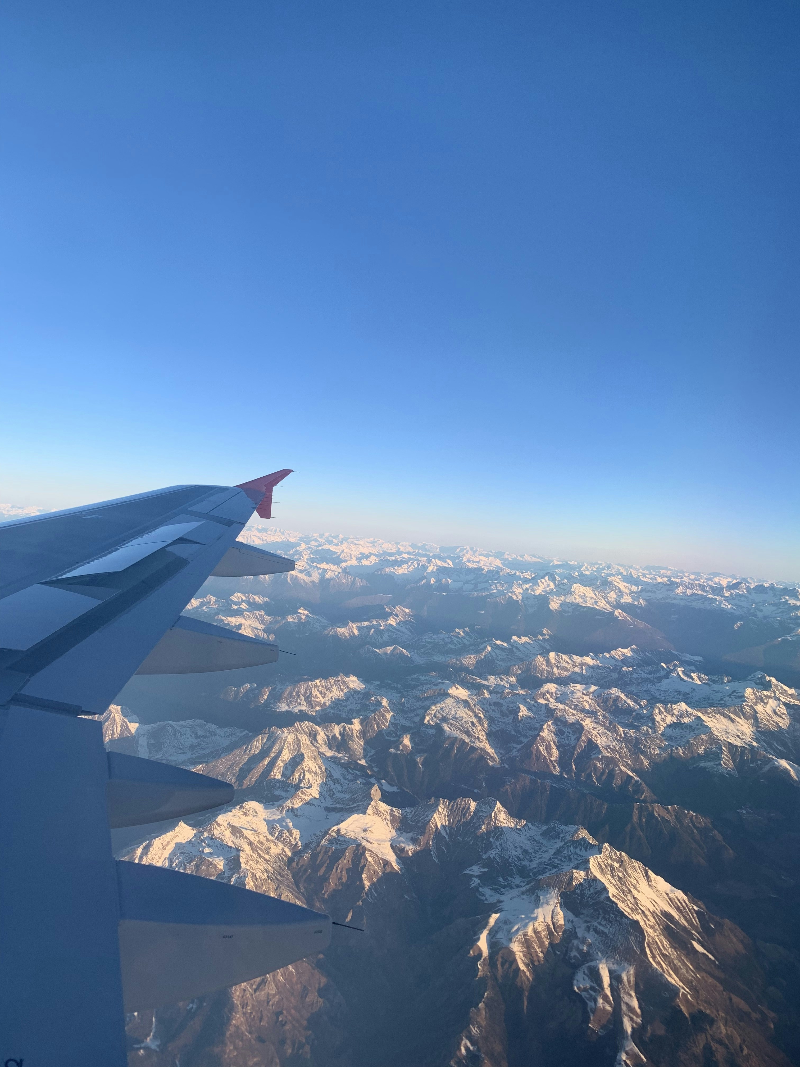 White airplane window wing view photo – Free Outdoors Image on Unsplash