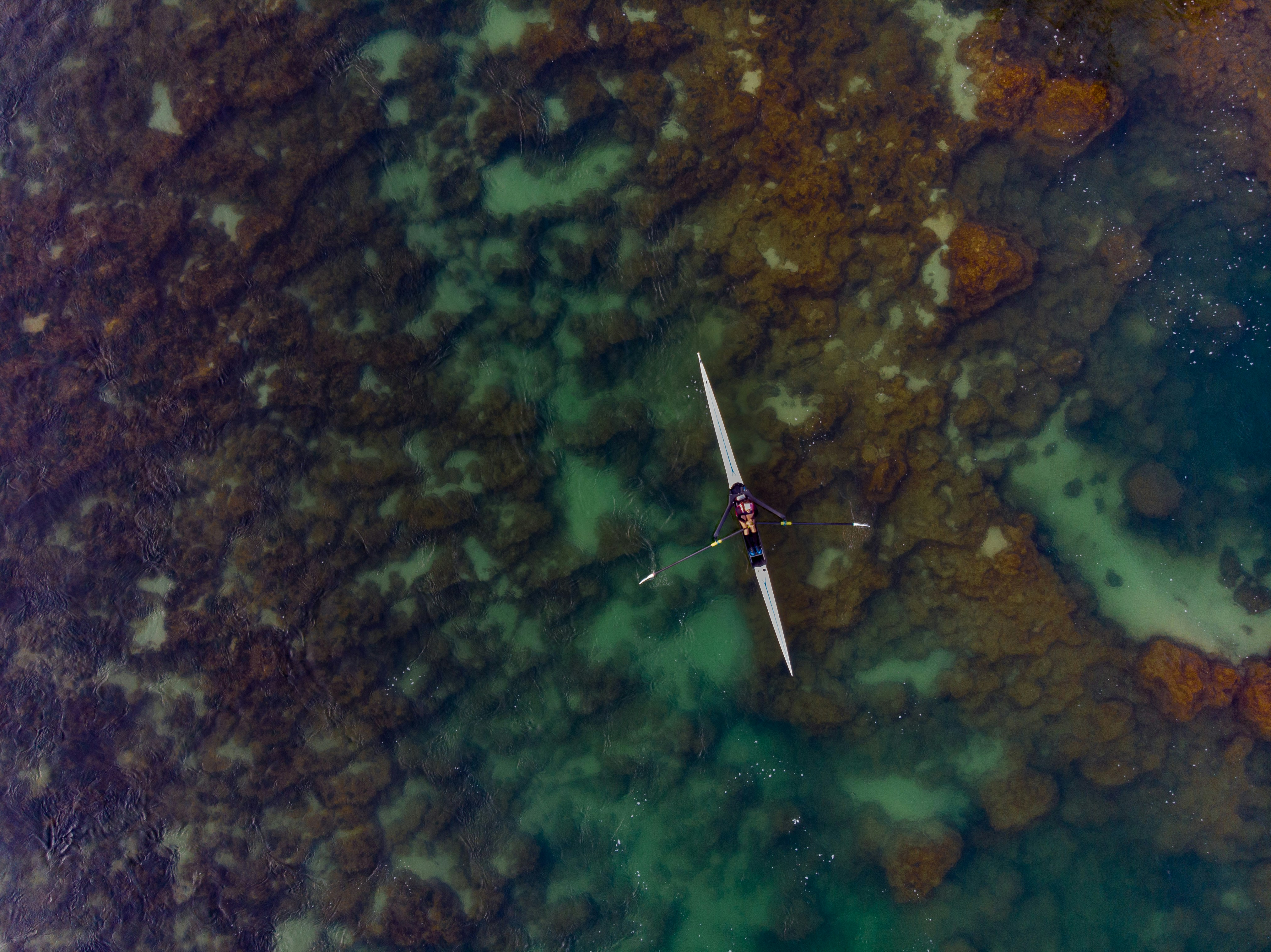 Aerial photography of person boating on body of water photo – Free Land ...
