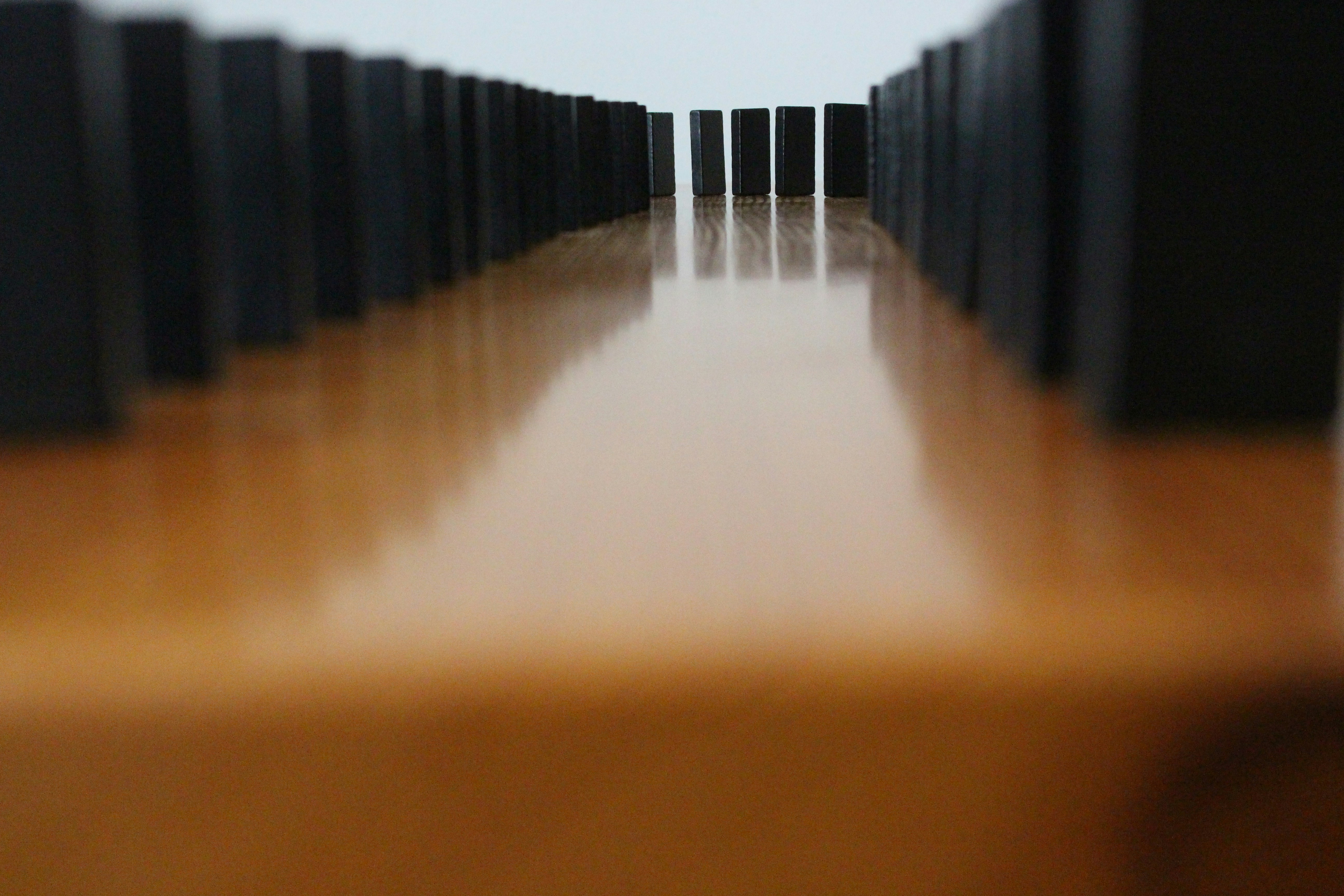 Vanishing Row of Black Uprights Toward a Bright Gap