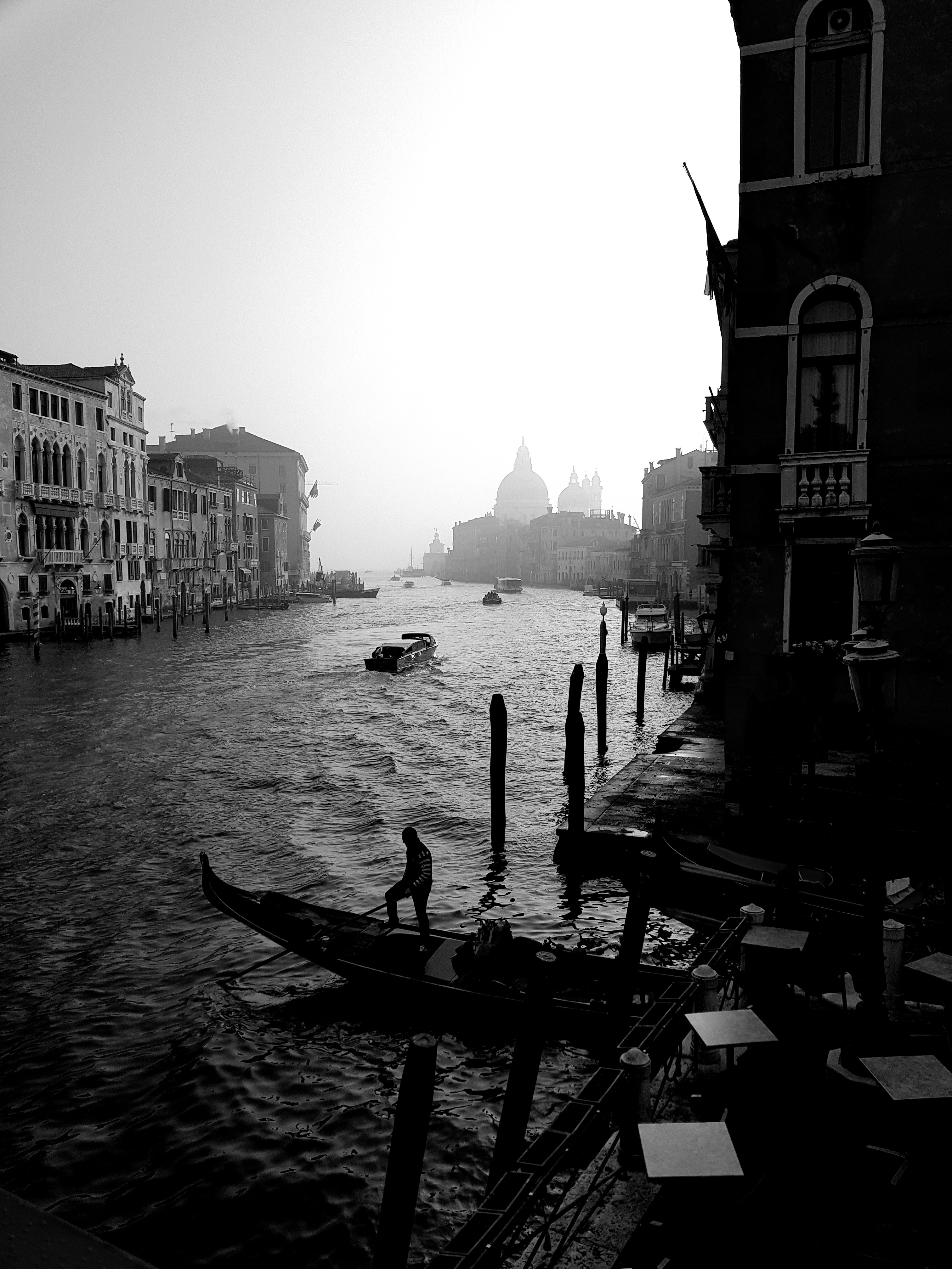 Grayscale photography of body of water beside buildings photo – Free ...