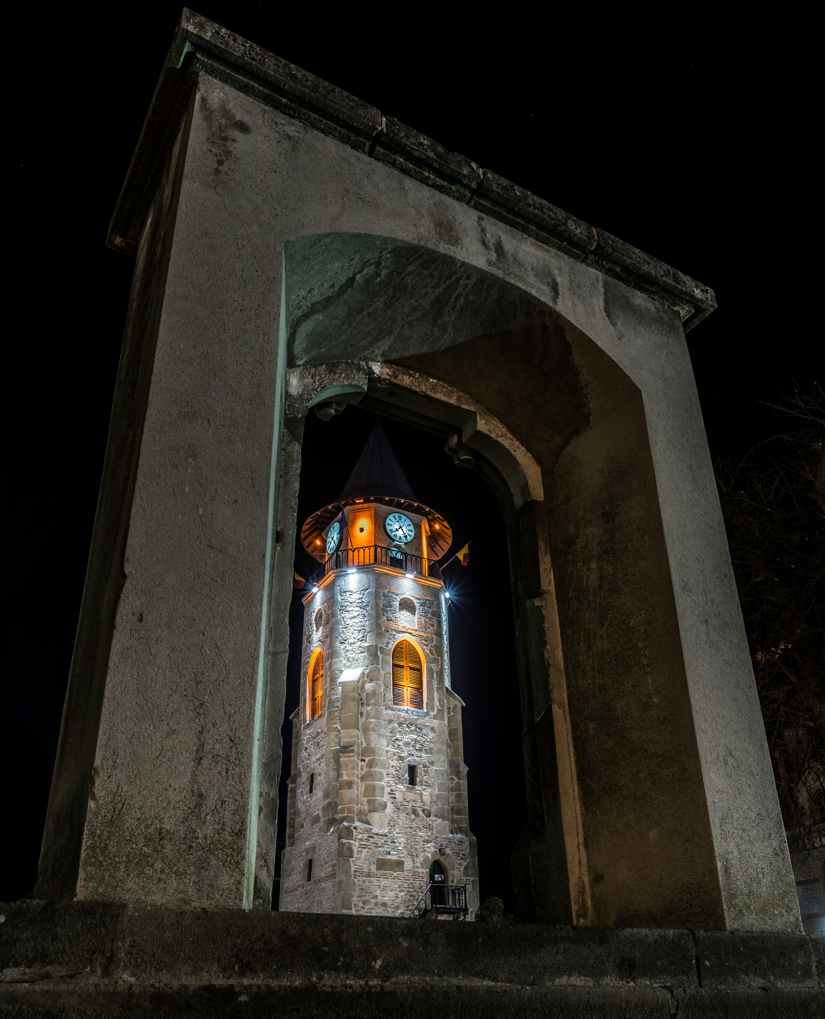 Moonlit Archway Framing a Lantern Tower