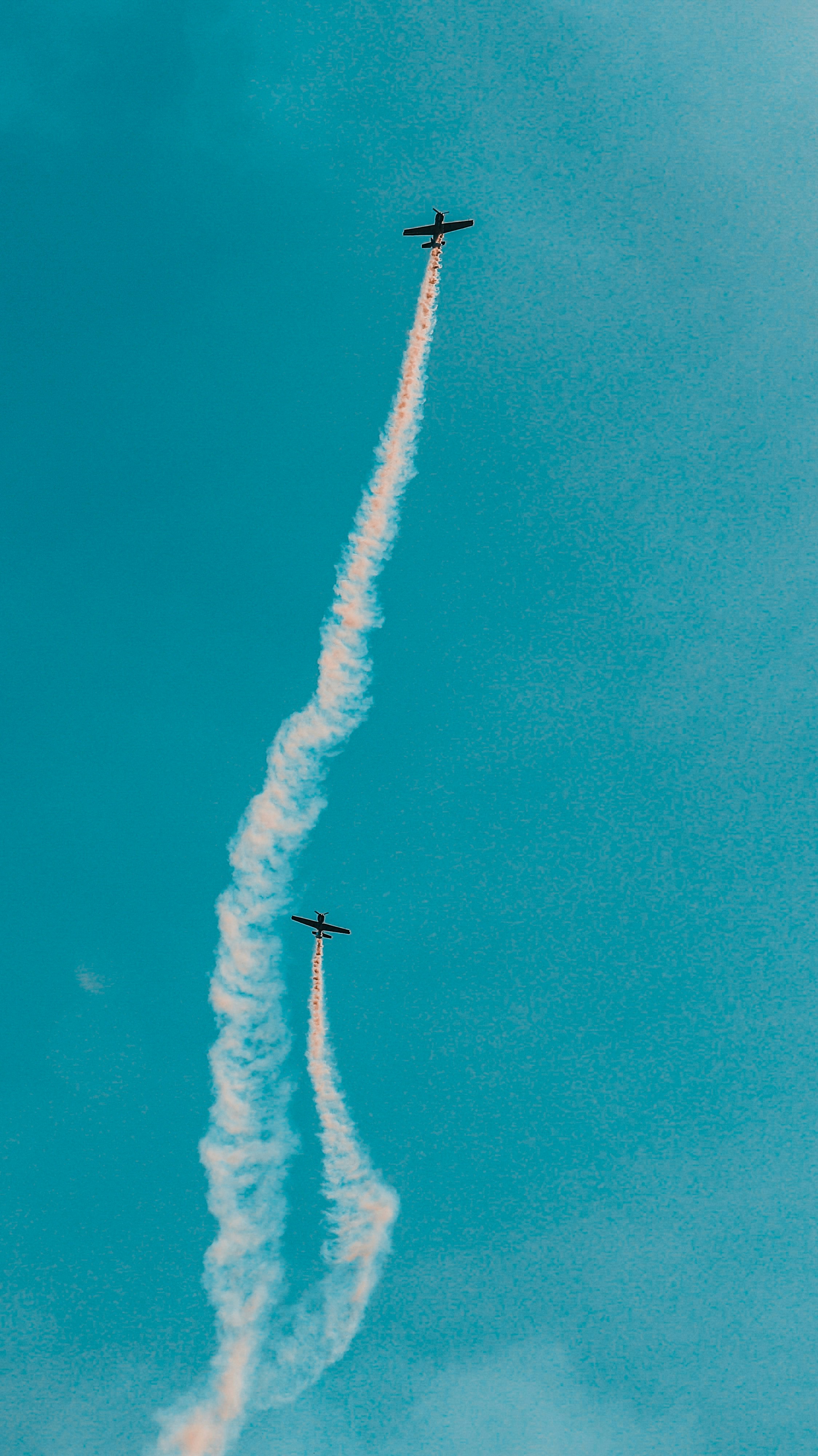 Two planes flying on air at daytime photo – Free Blue Image on Unsplash