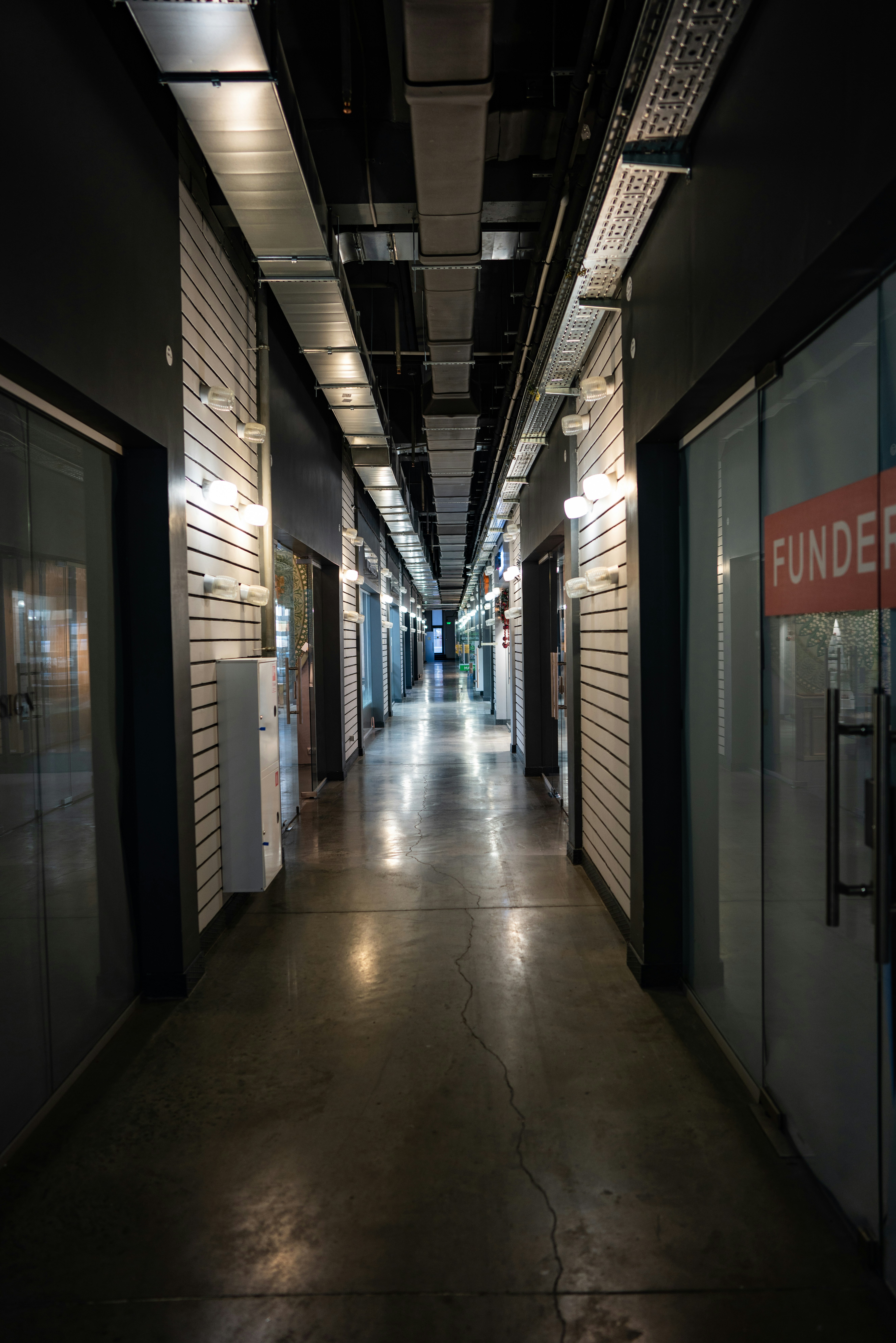 Closed stores on pathway in building photo – Free Grey Image on Unsplash