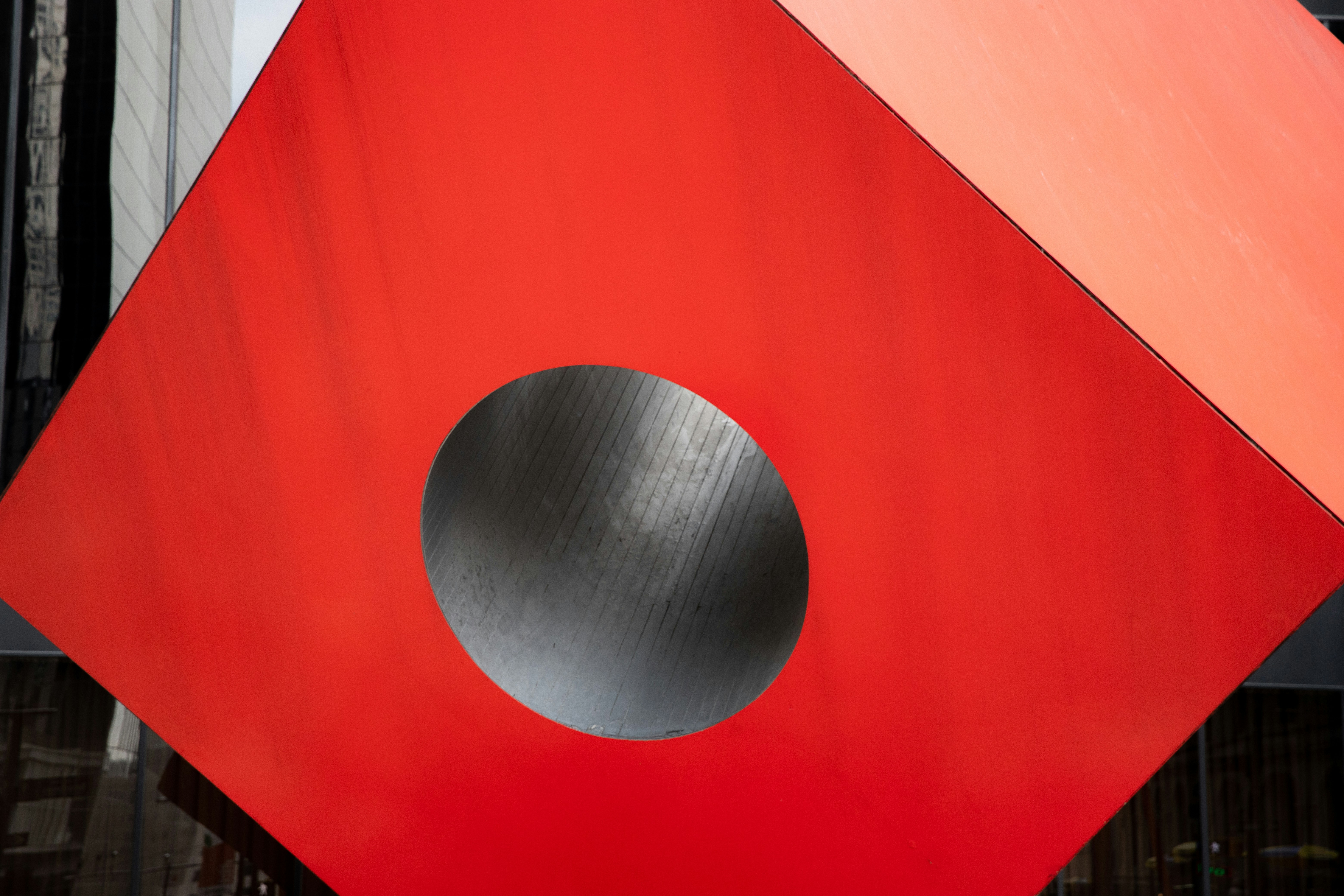 Red Diamond with a Circular Cutout: An Urban Geometry Portrait