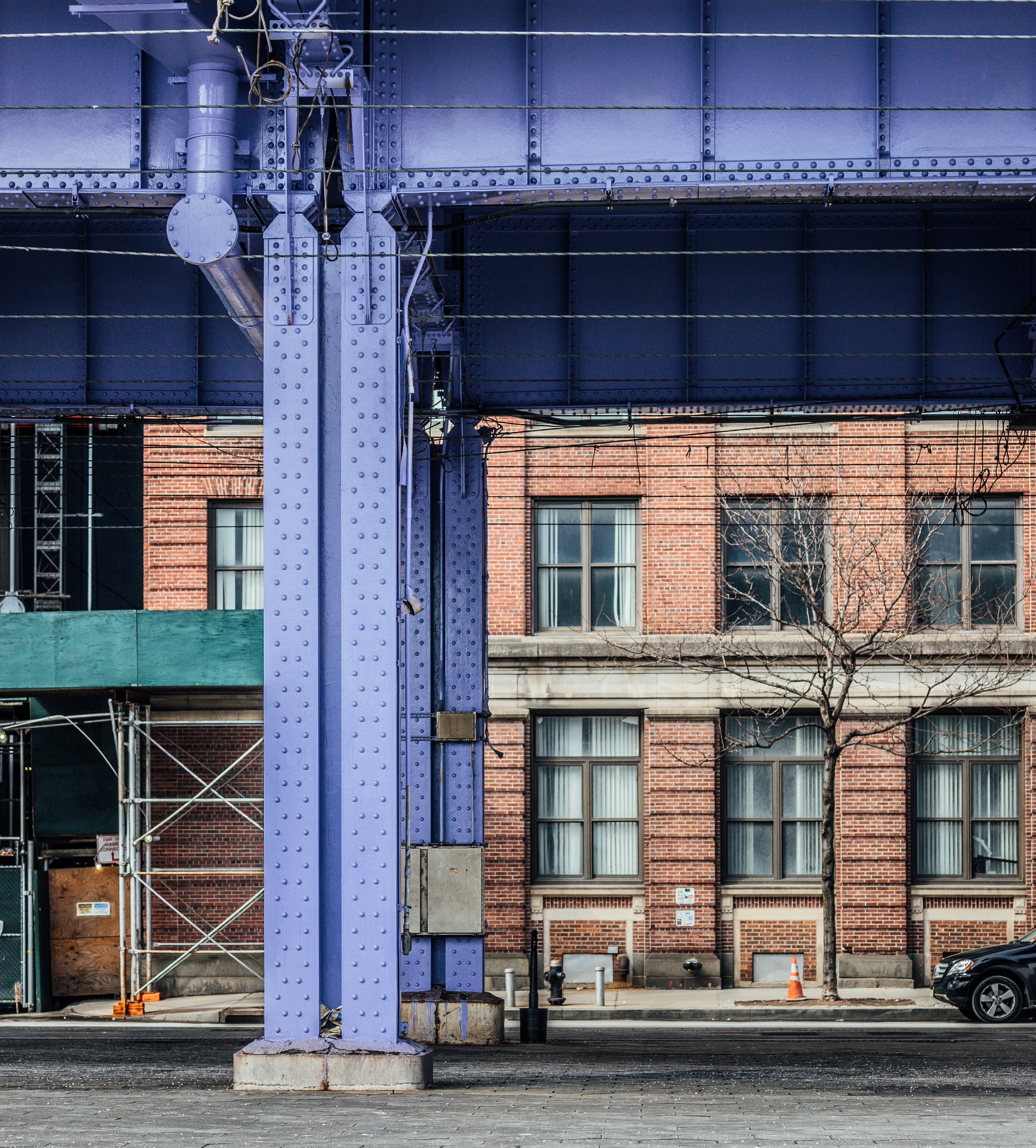 Blue iron underpinnings: city street meets elevated structure
