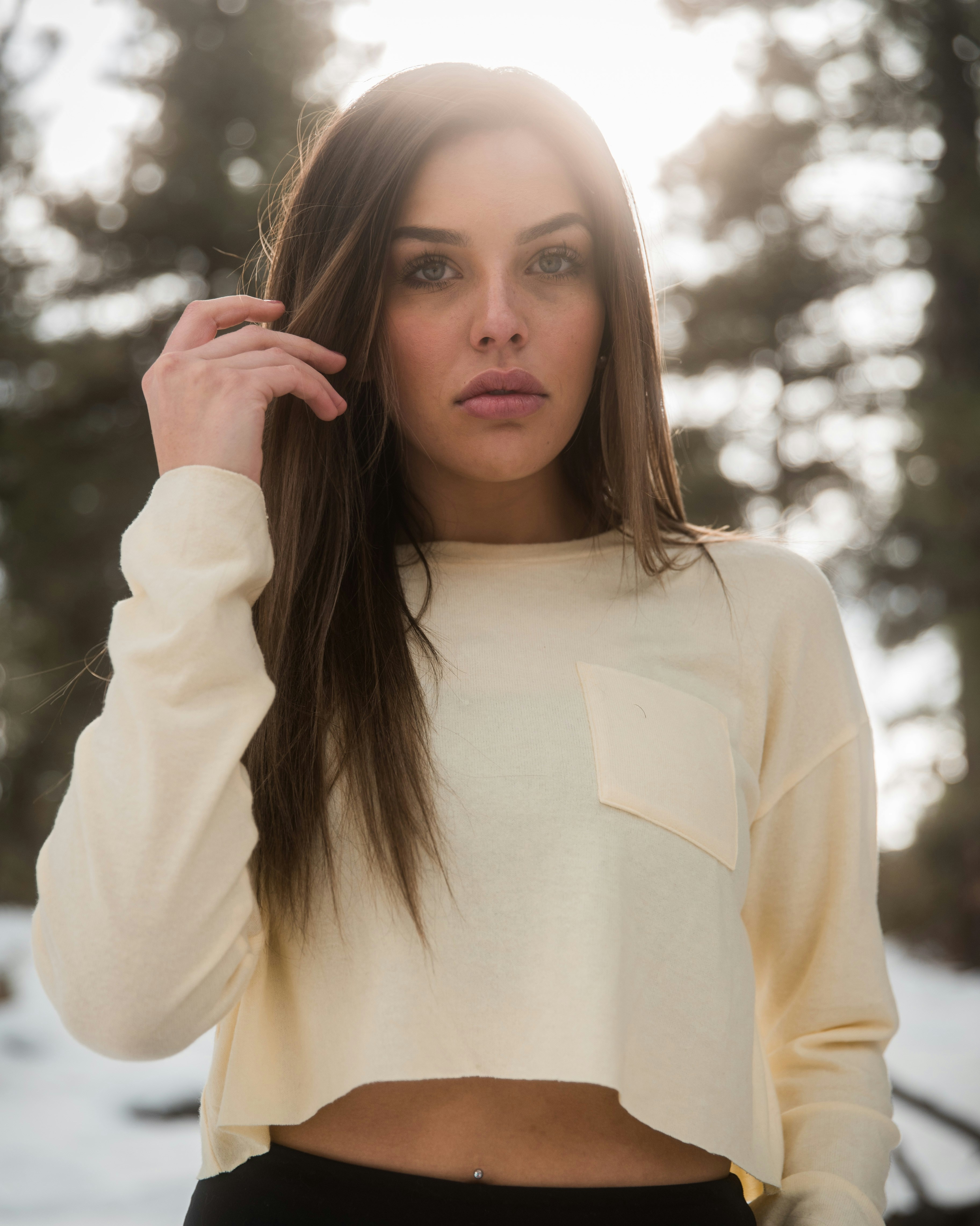 Shallow focus photo of woman in white crew-neck long-sleeved crop top ...