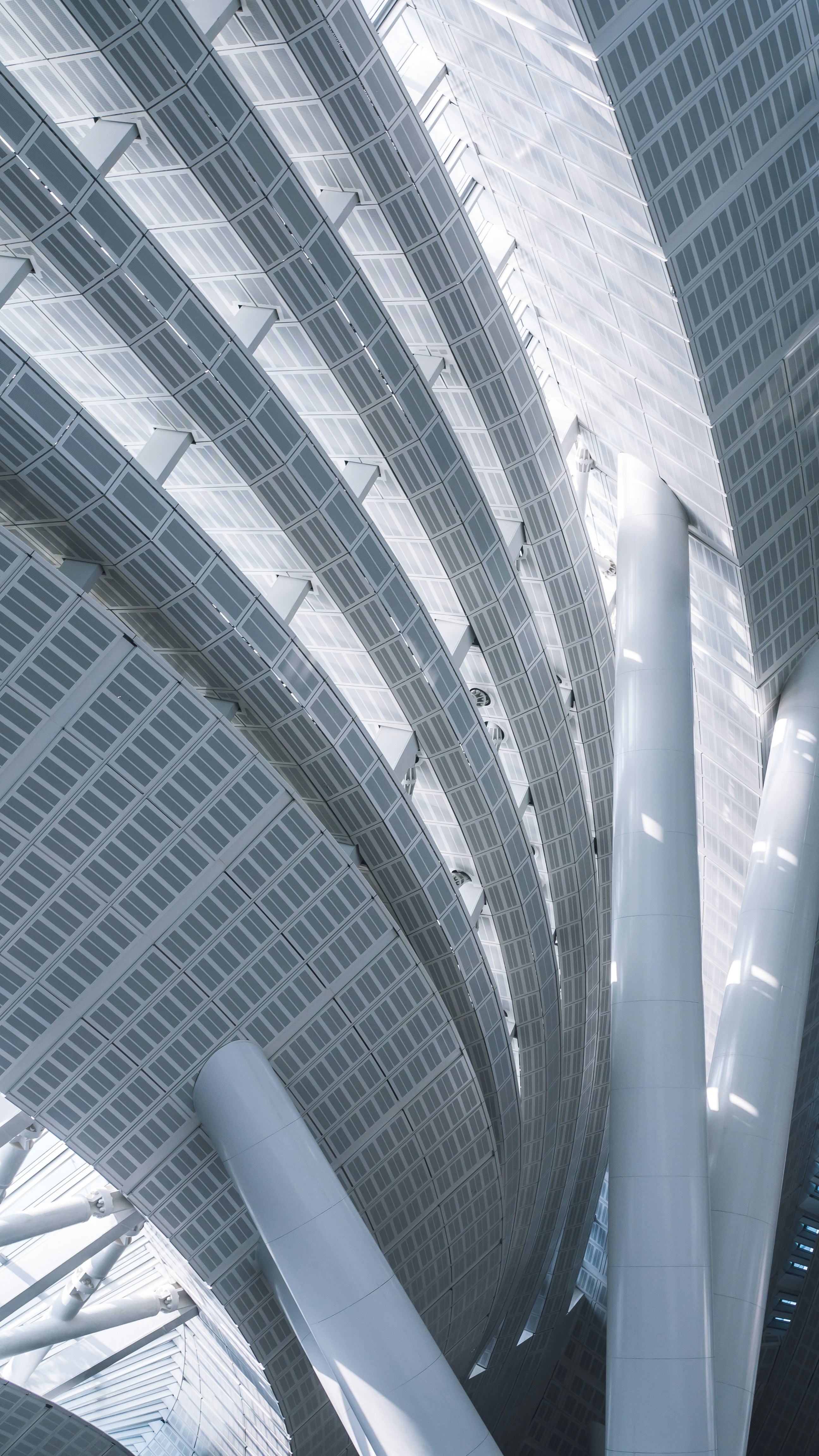 Grey high rise buildings connected with large beams photo – Free Grey ...