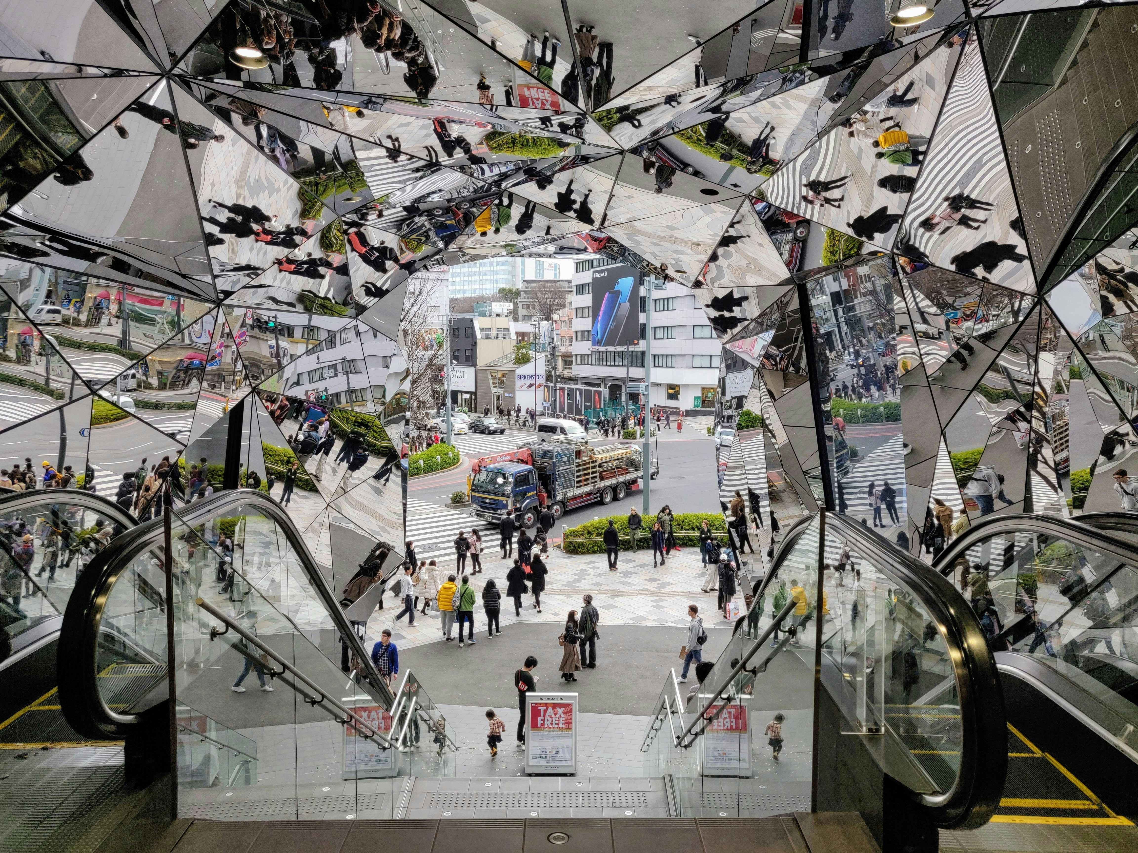 Mirrored Atrium: A City Within a Glass Canyon
