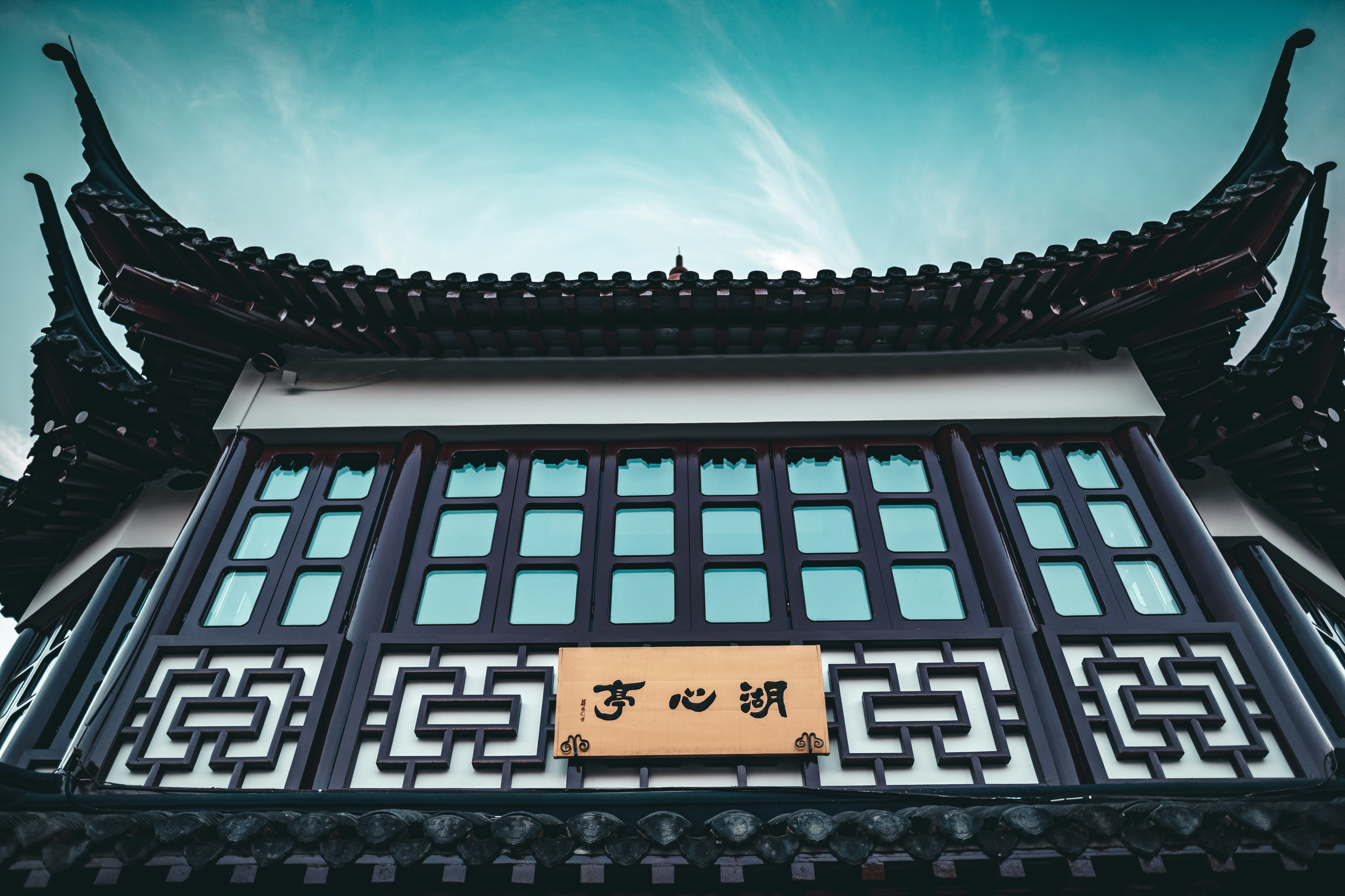 Ornate East-Asian Facade Under a Dynamic Sky