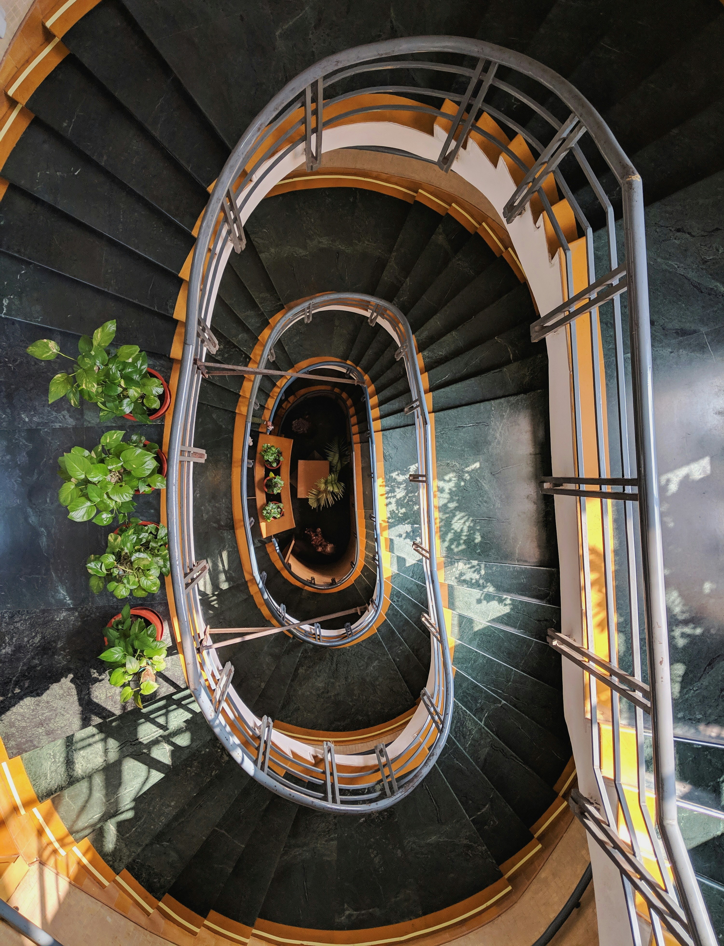 Spiral Descent: A Bird's-Eye of the Coiled Staircase