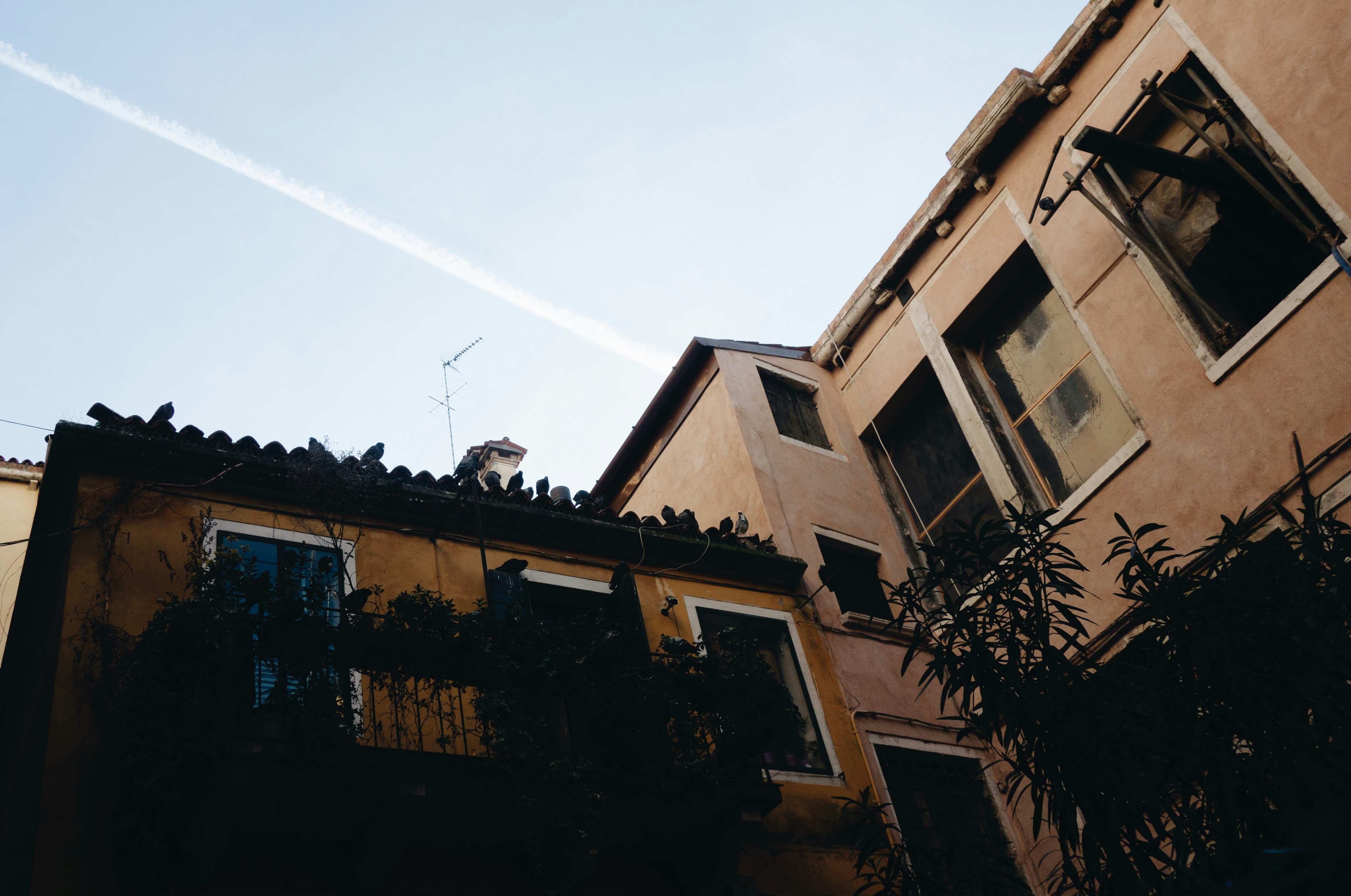 Contrail over Angular Facades: A Quiet Urban Portrait