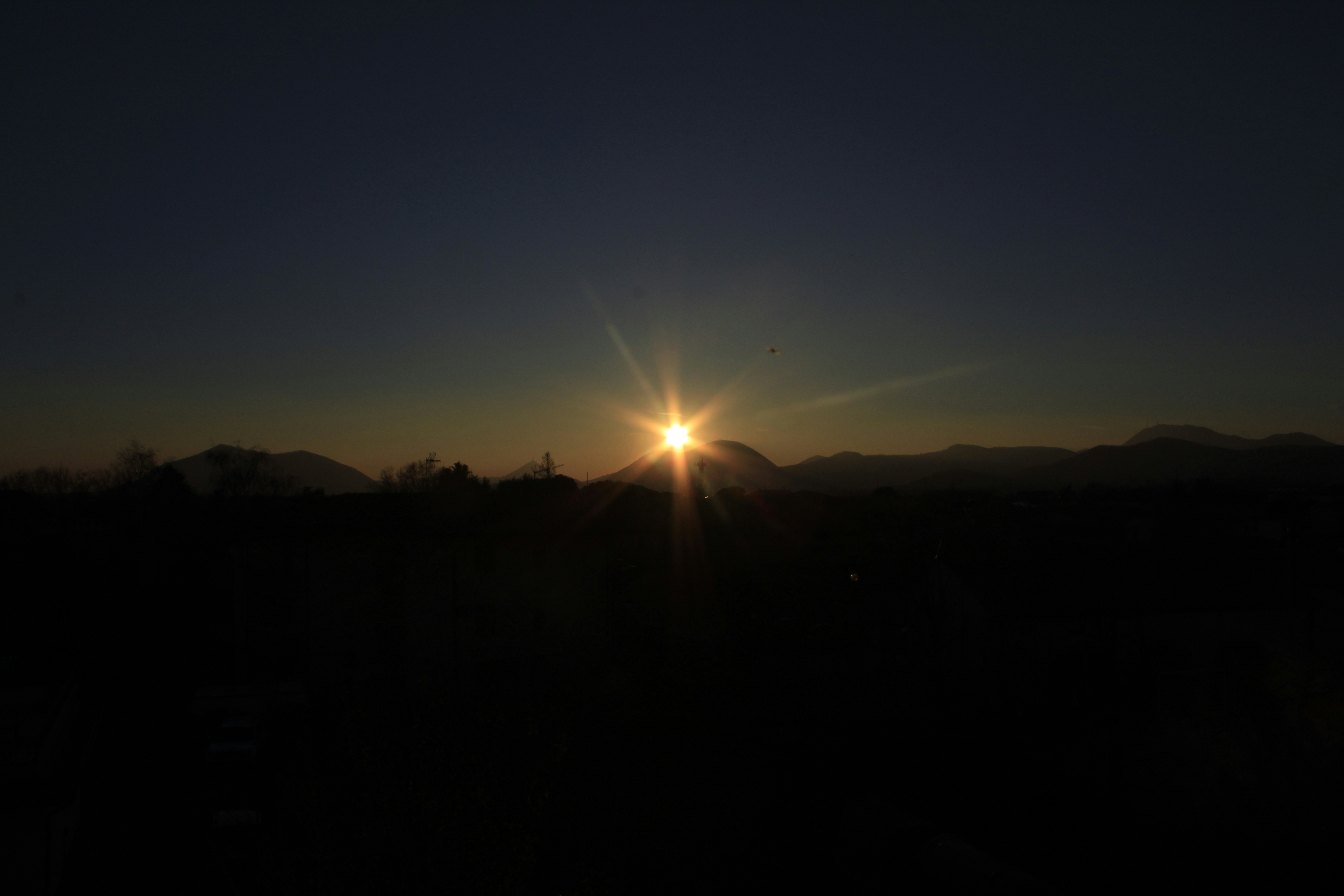 Sunrise Symphony over Distant Peaks