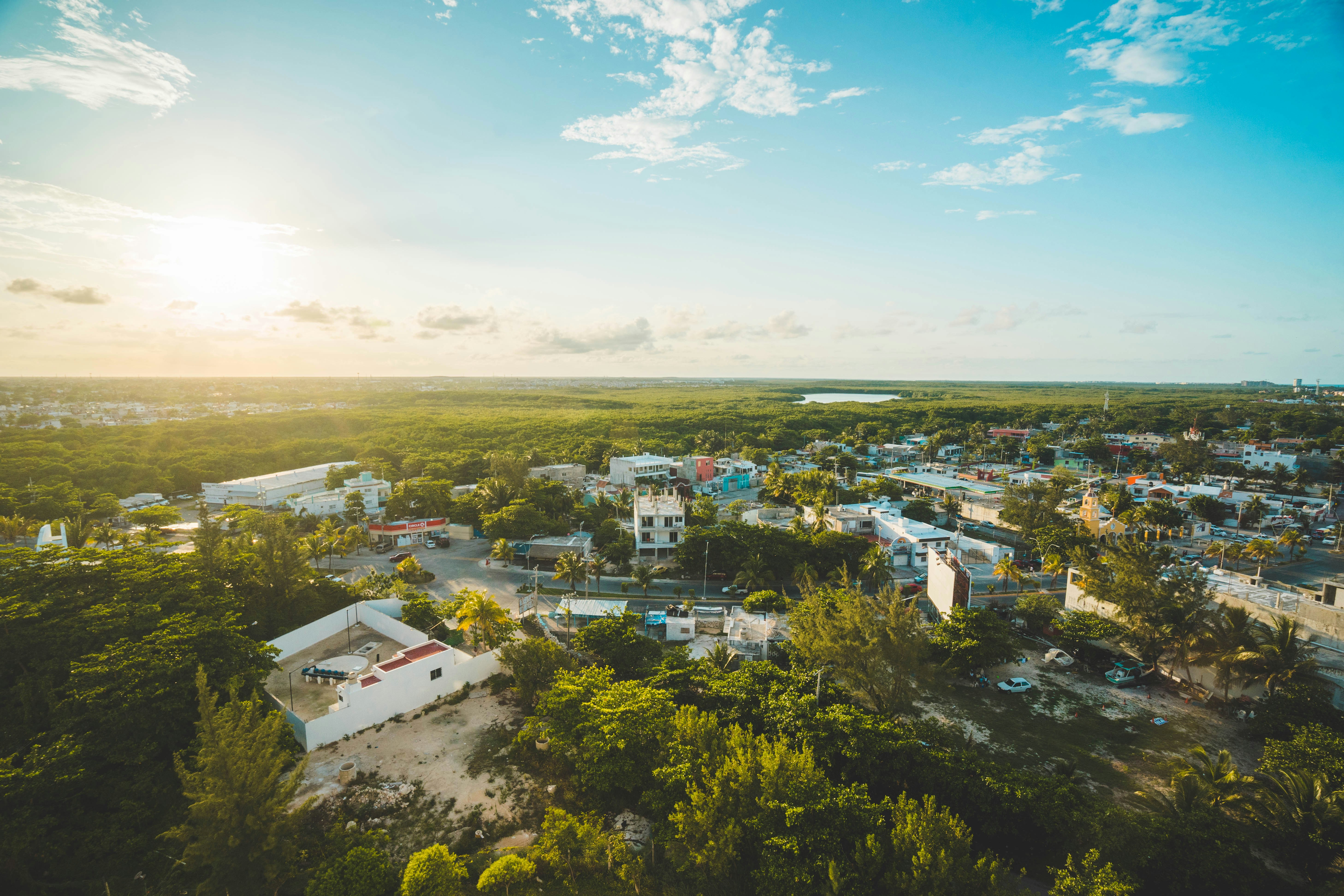 Sunlit Coasts: Aerial View Over Quiet Town at Dusk