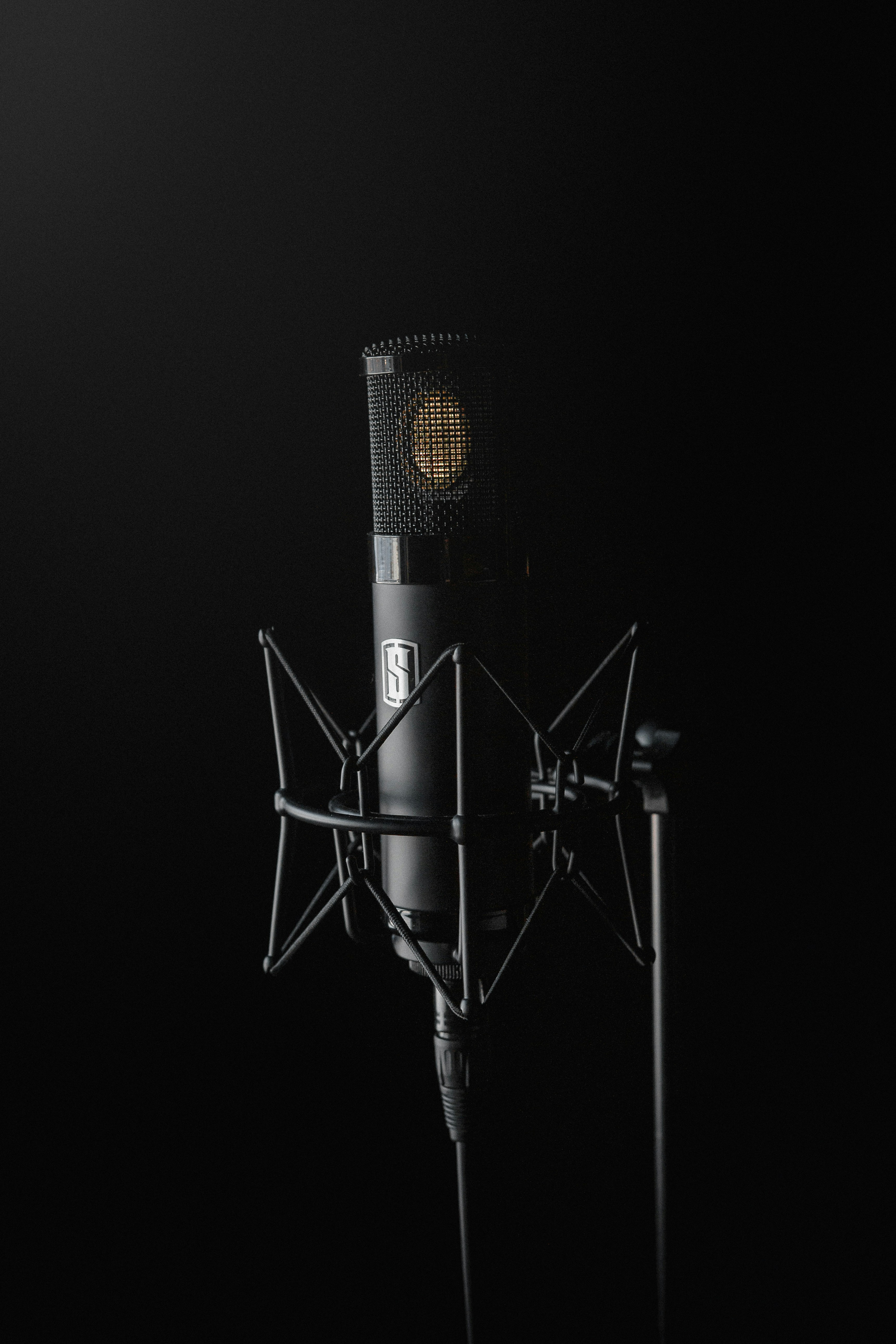 Black condenser microphone on black background photo – Free Black Image ...