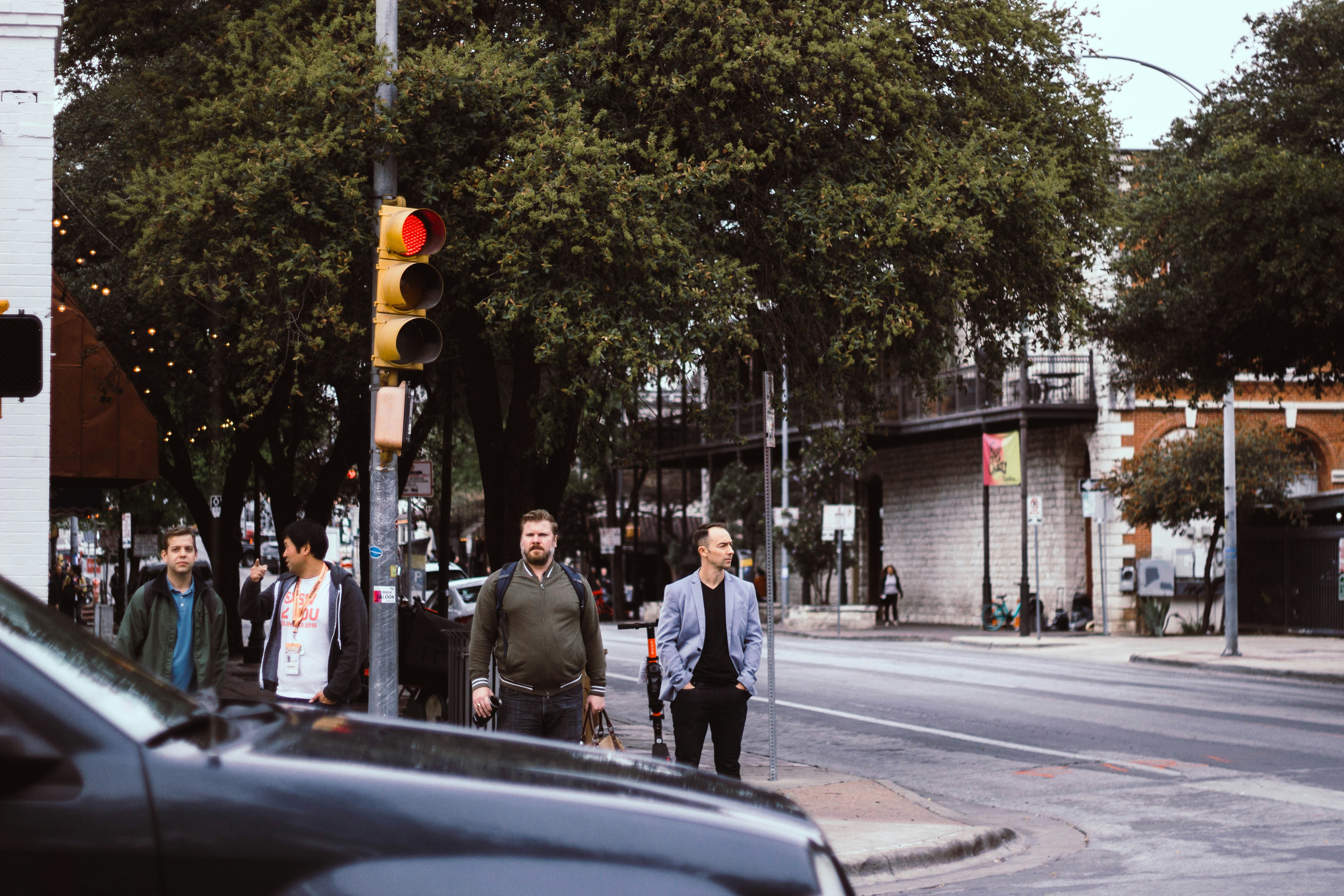 Men waiting to pass at the traffic light photo – Free Pedestrian Image ...