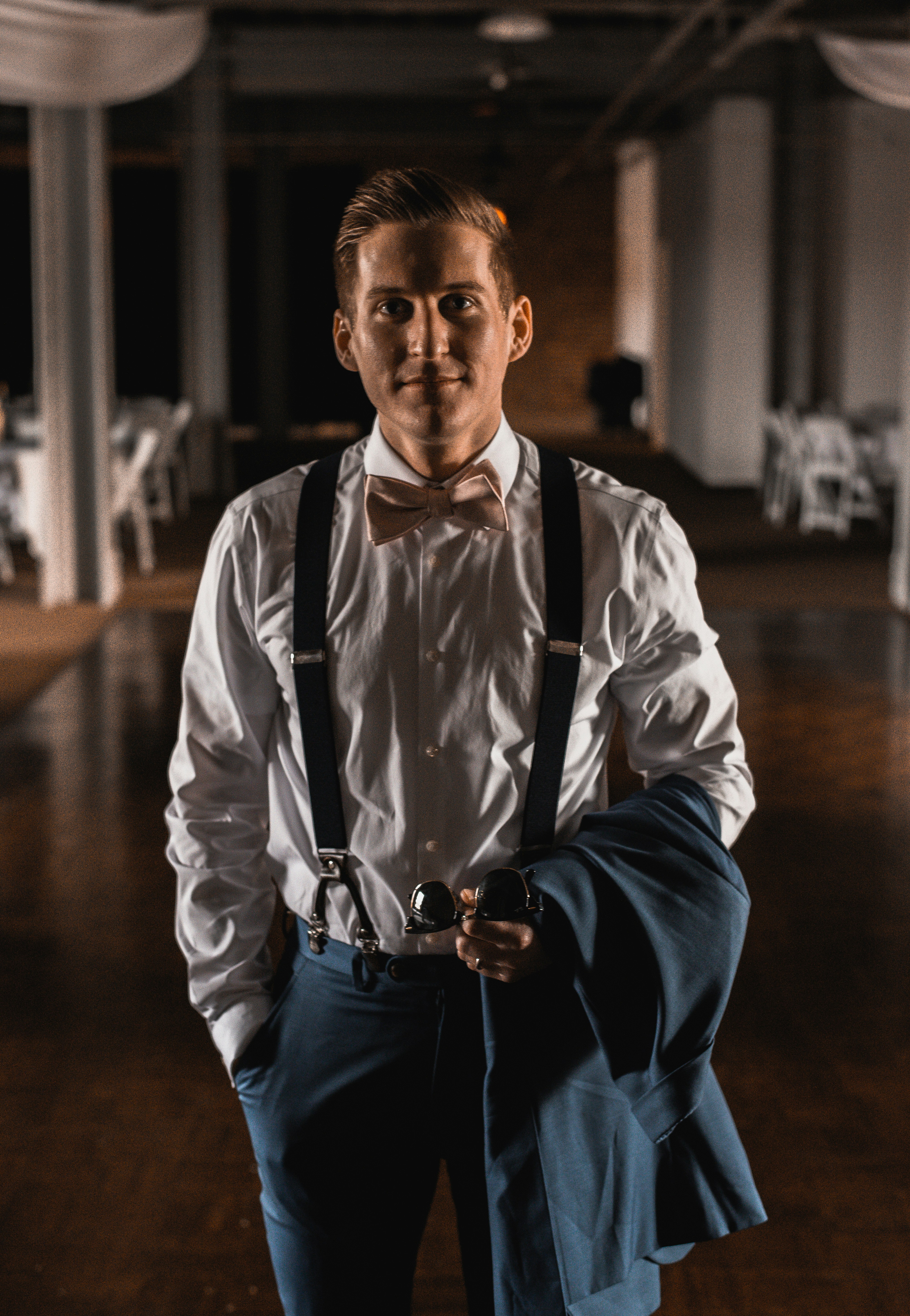 Suspenders in the Spotlight: A Gentleman in a Quiet Ballroom