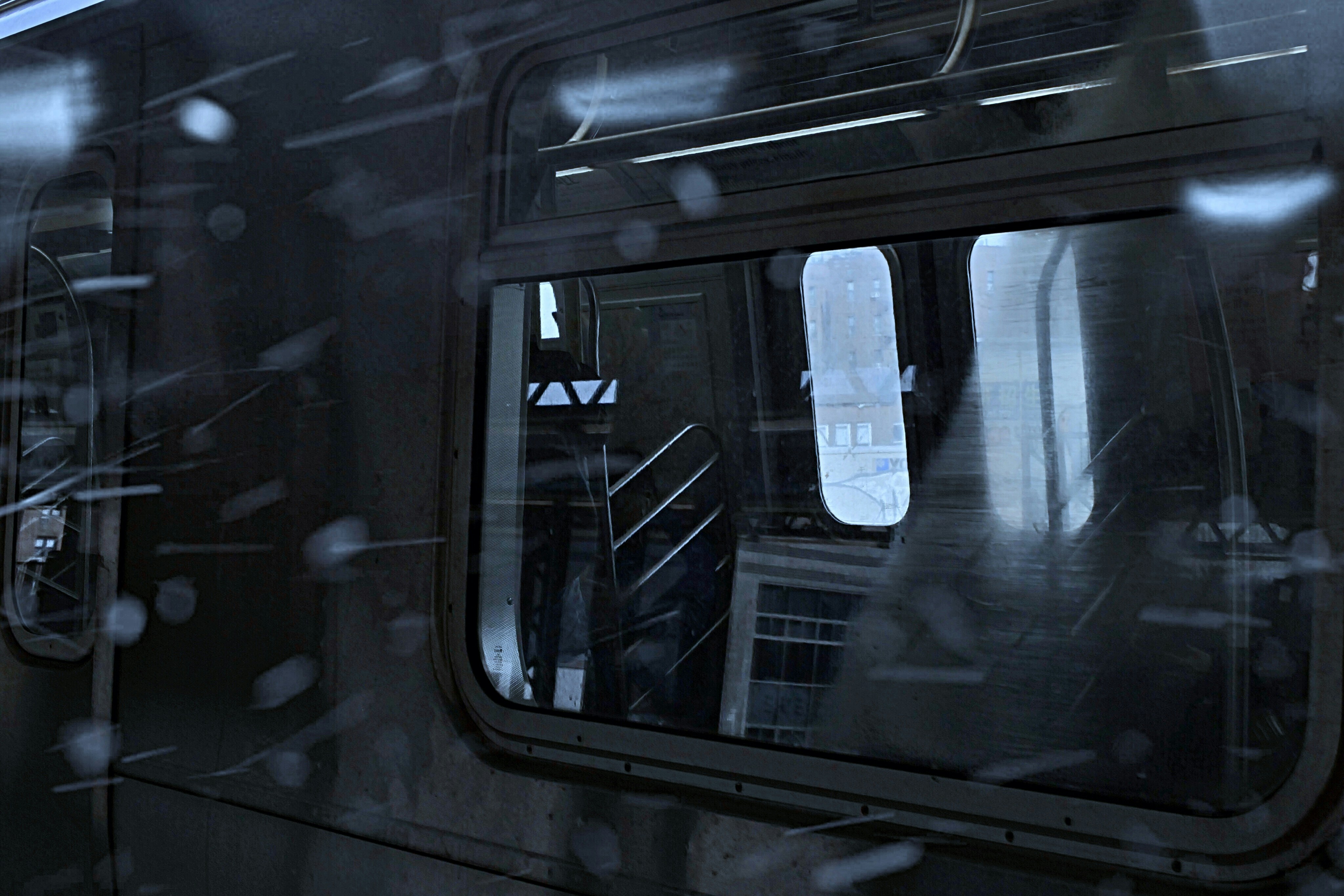 A view of a train through a window in the rain photo – Free Brooklyn ...