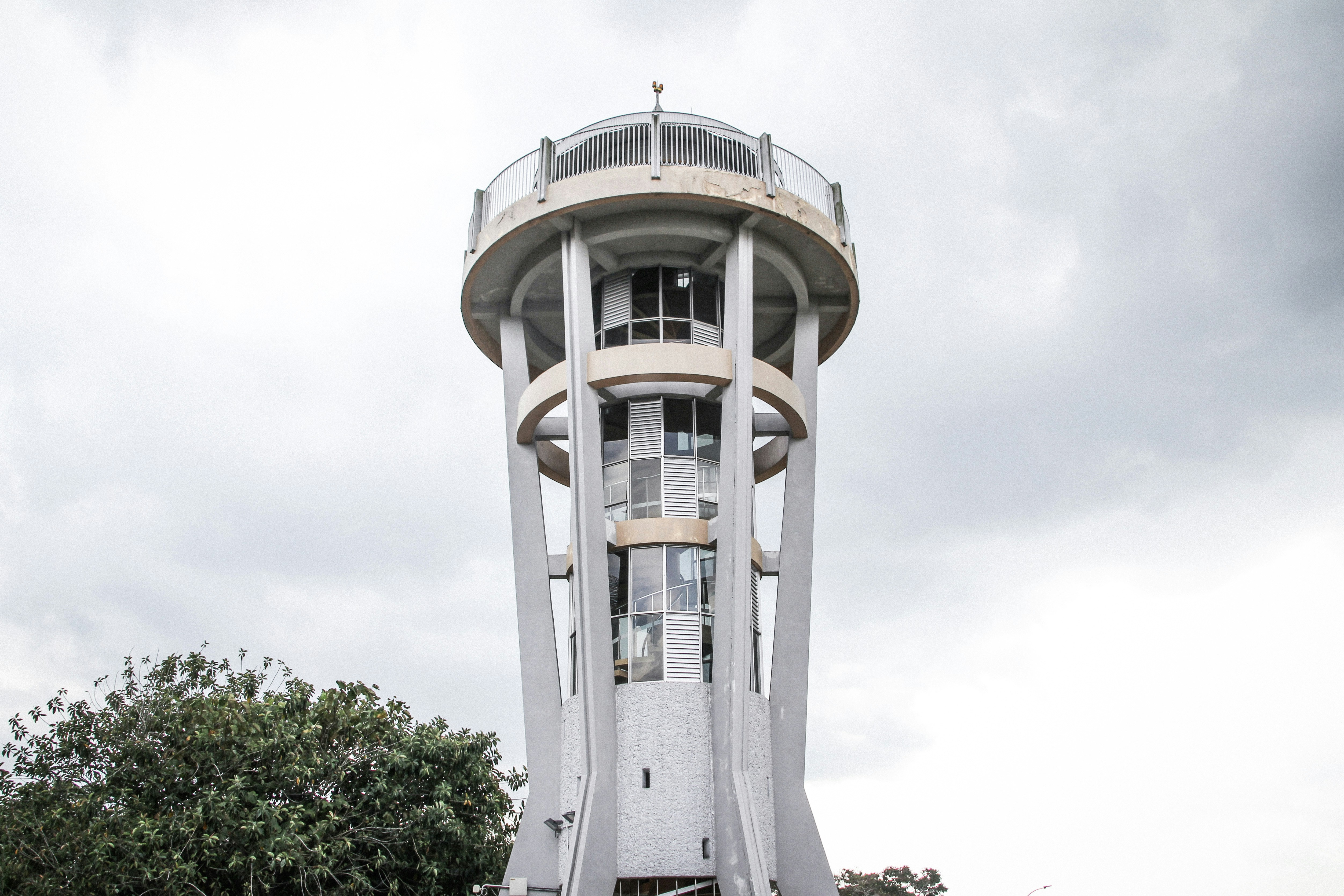 Ringed Summit: A Concrete Lookout Against Cloudy Skies