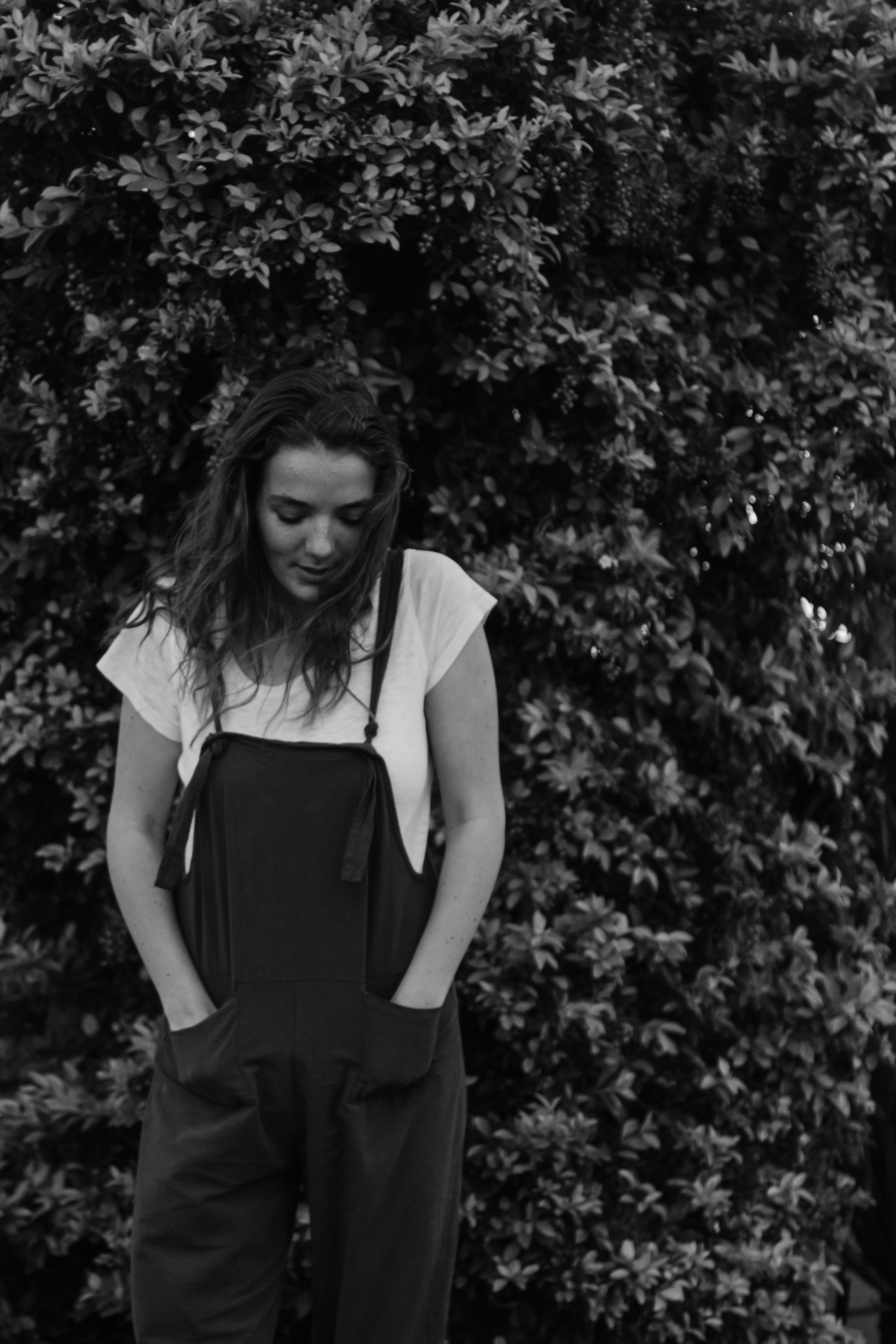 Grayscale photo of woman standing in front of bush photo – Free Human ...